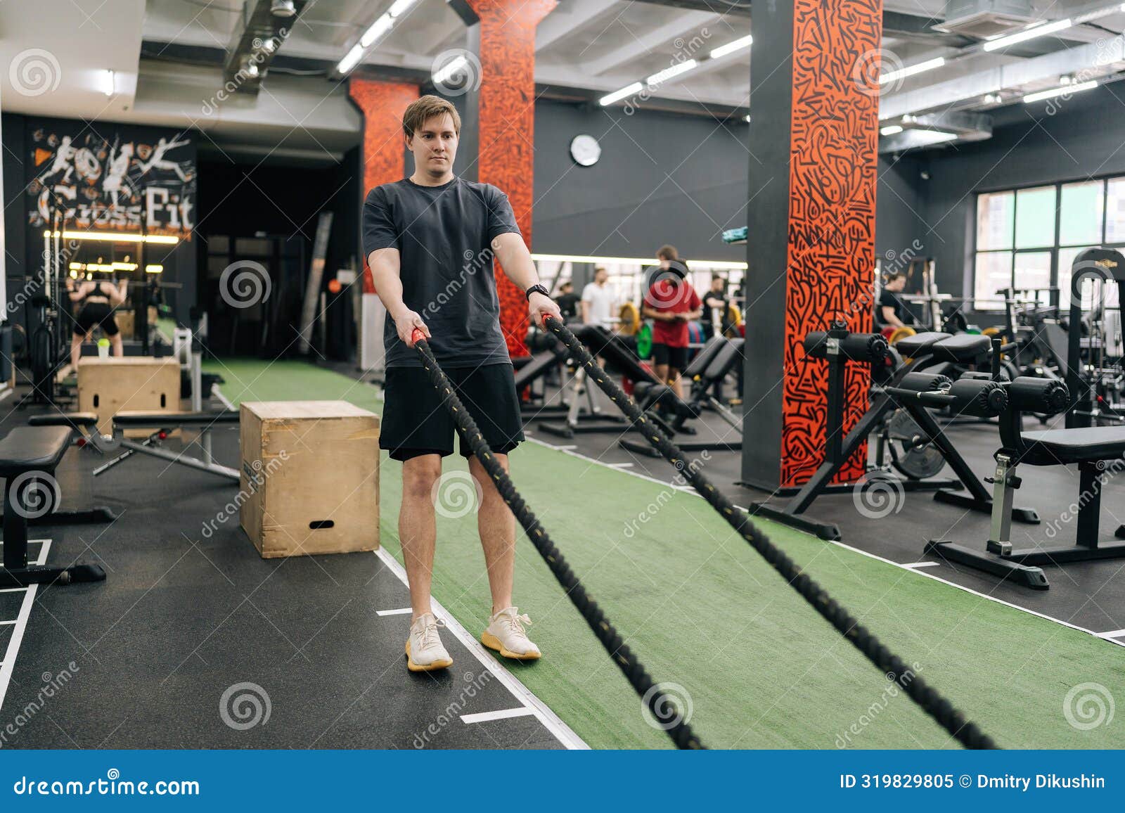 Portrait of Beginner Sportsman Doing Battle Ropes Functional Training ...