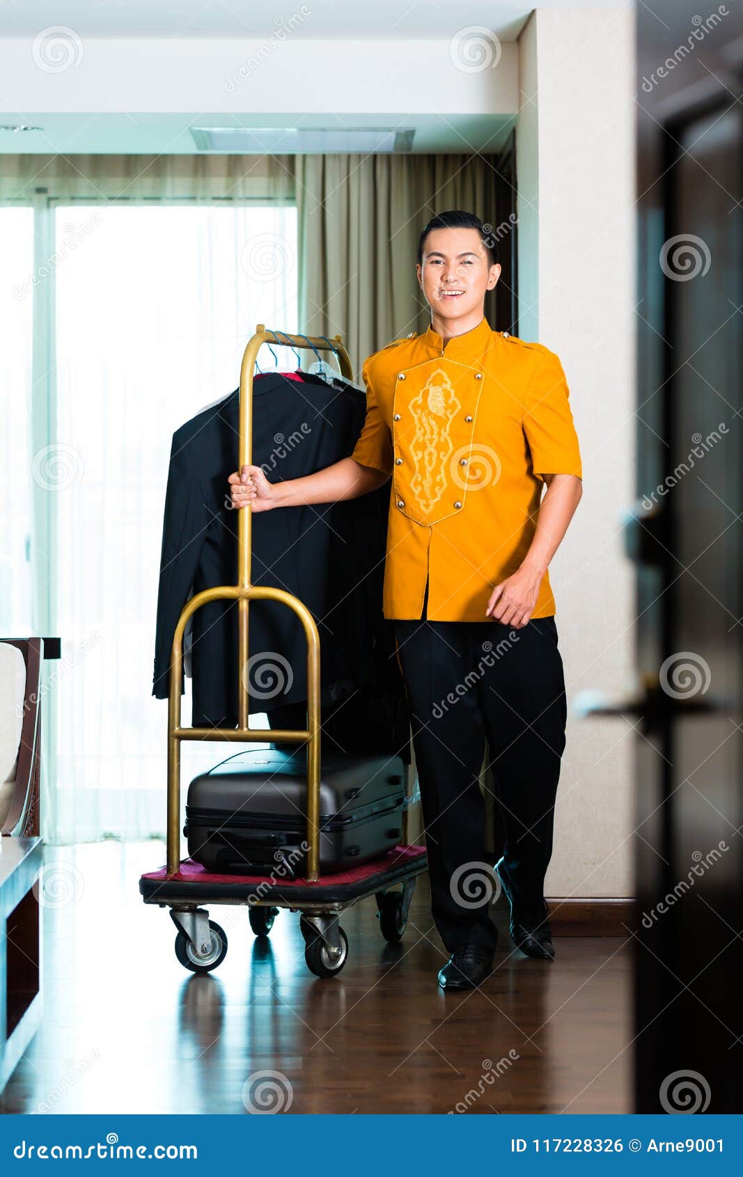 Portrait of Asian Bell Boy Pulling Box Van Stock Photo - Image of adult ...