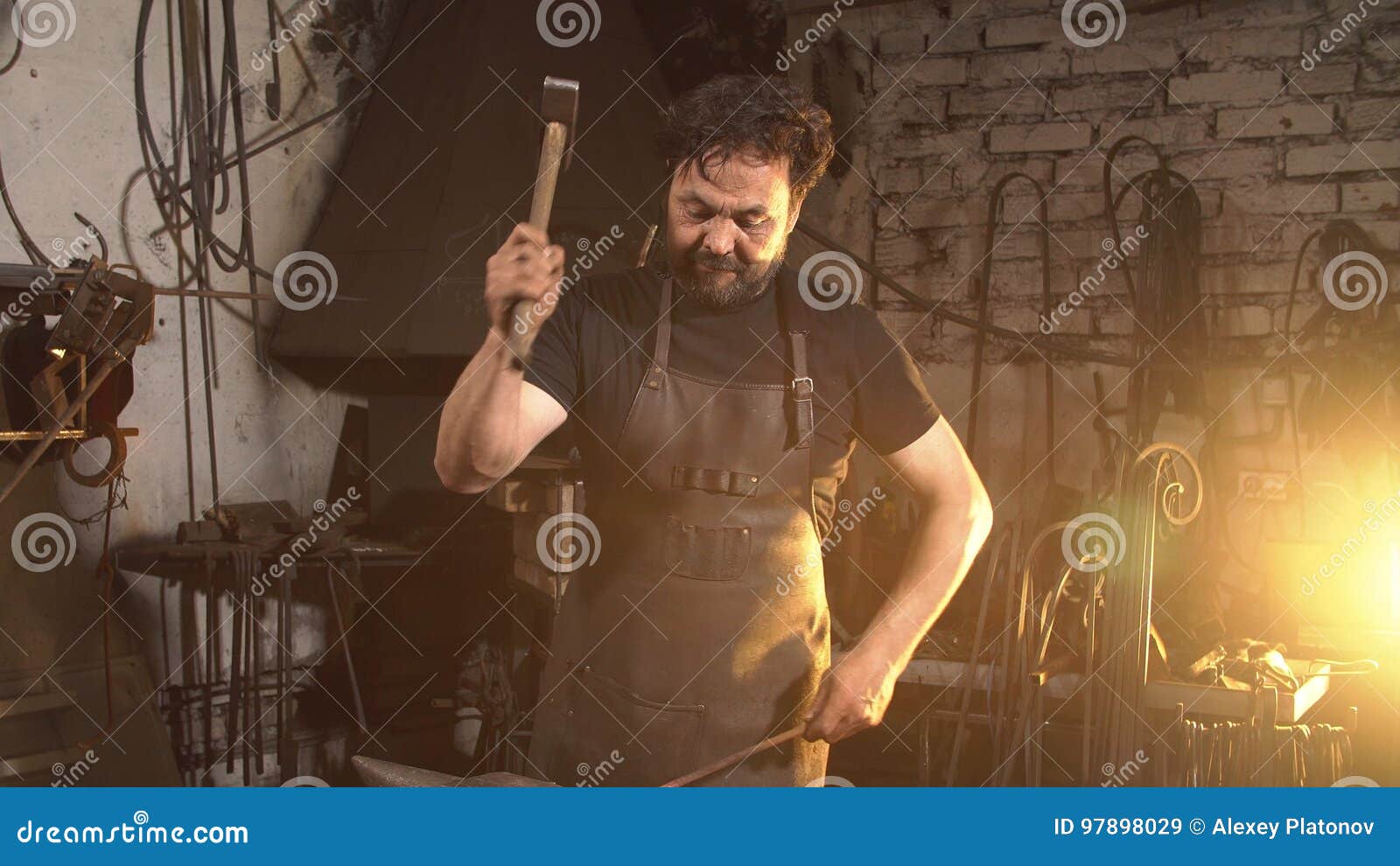Portrait of a Blacksmith in the Working Atmosphere. a Man Works with ...