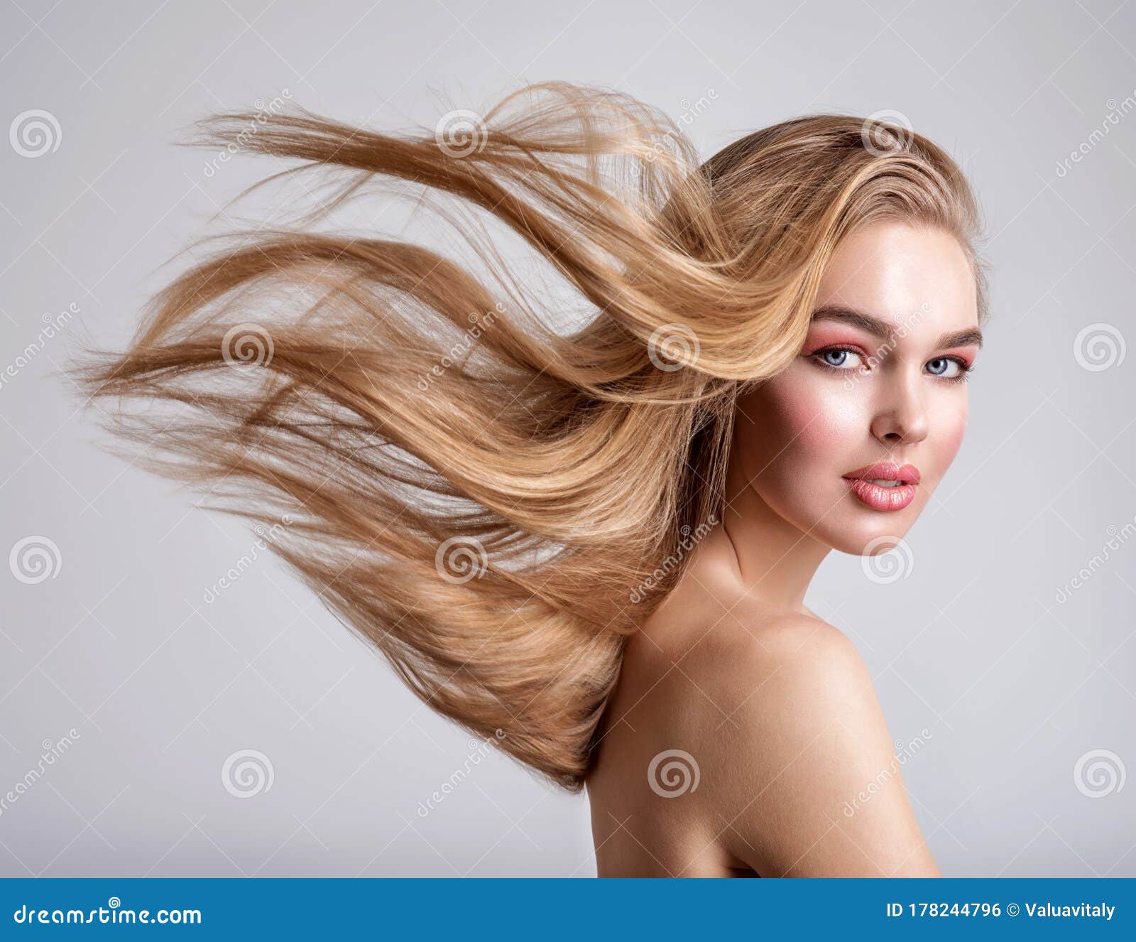Portrait Of A Blonde Beautiful Woman With A Long Straight Light Hair