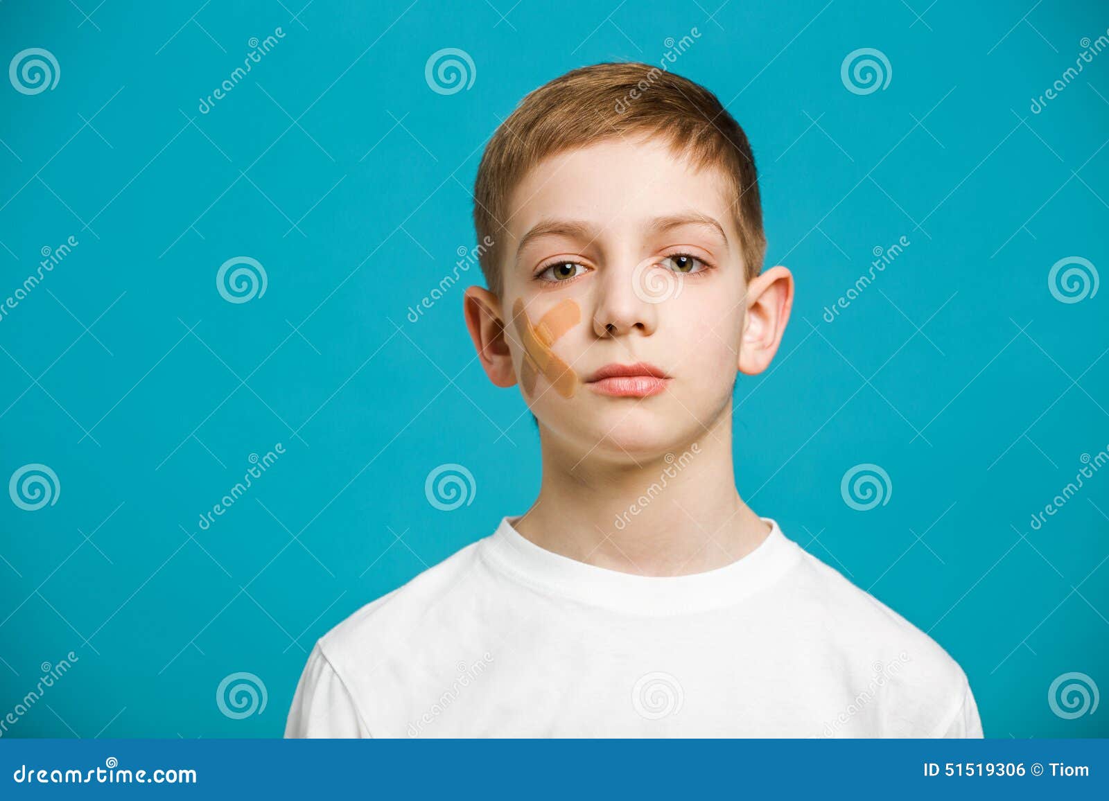 Portrait of a Boy with Adhesive Plaster on His Cheek Stock Photo ...