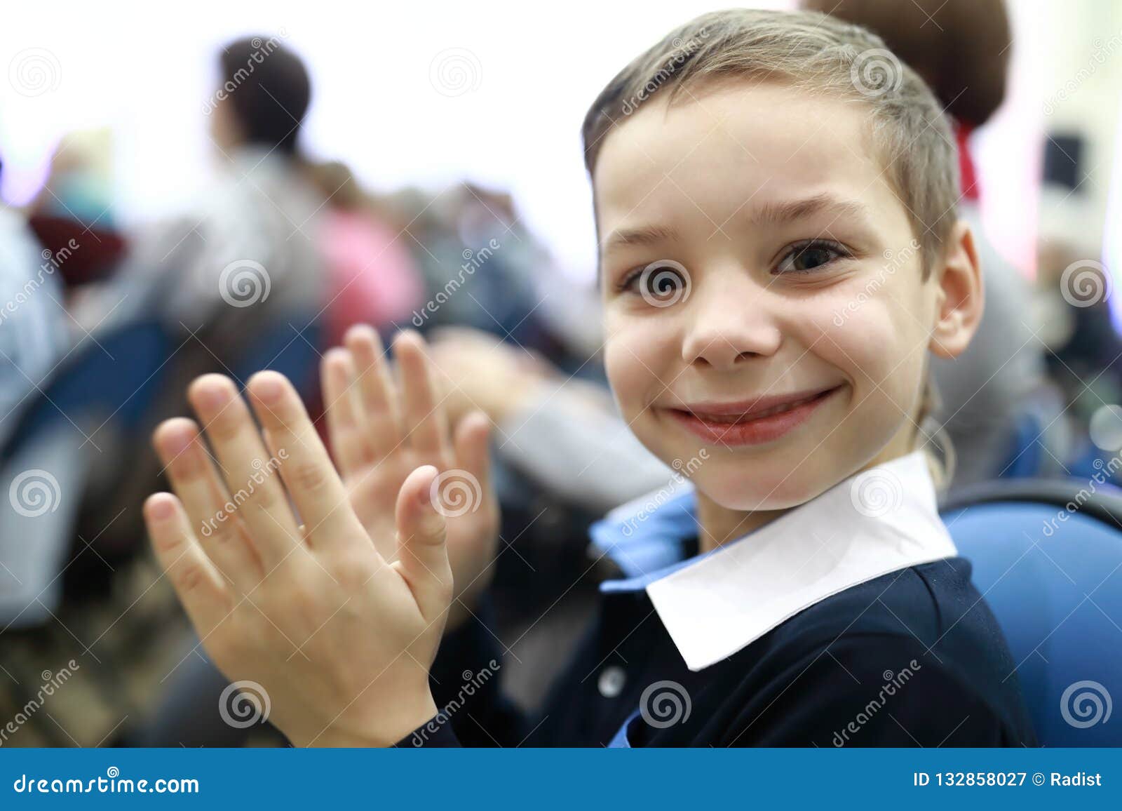 Boy applauds at concert stock image. Image of indoor - 132858027