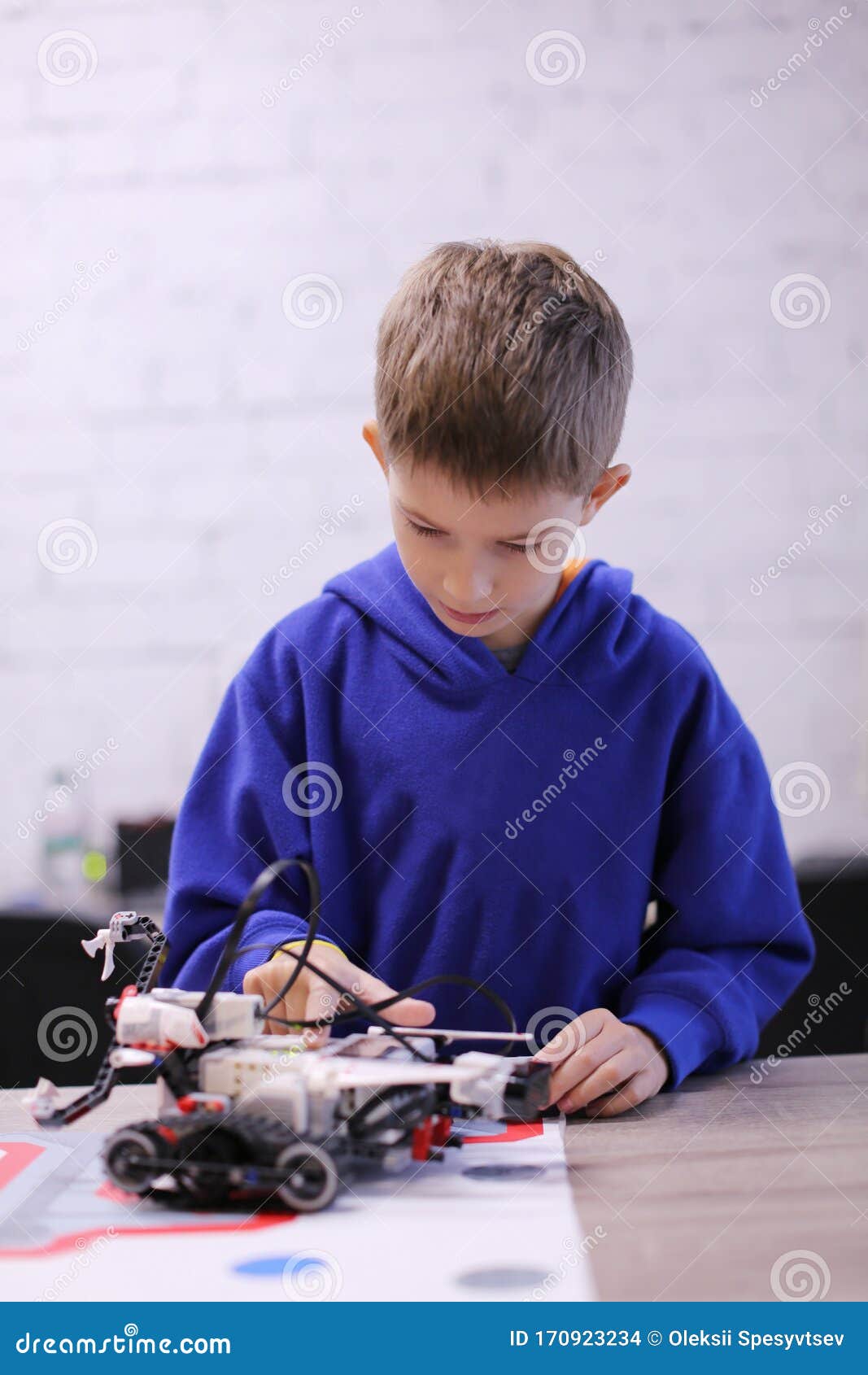 Portrait of a Boy Constructing a Robot at School Lesson. Robotics Stock ...