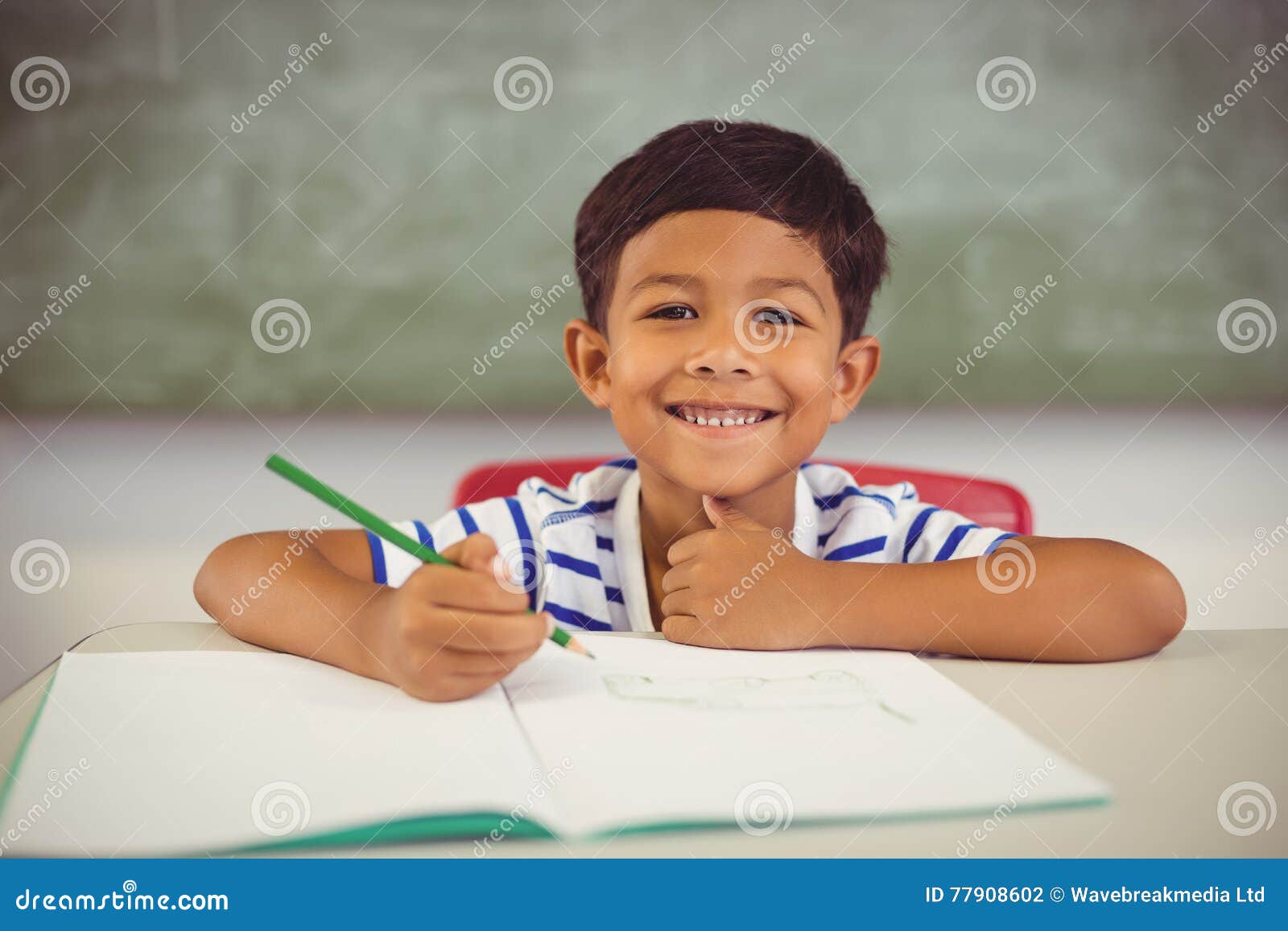 Portrait of Boy Doing Homework in Classroom Stock Photo - Image of ...