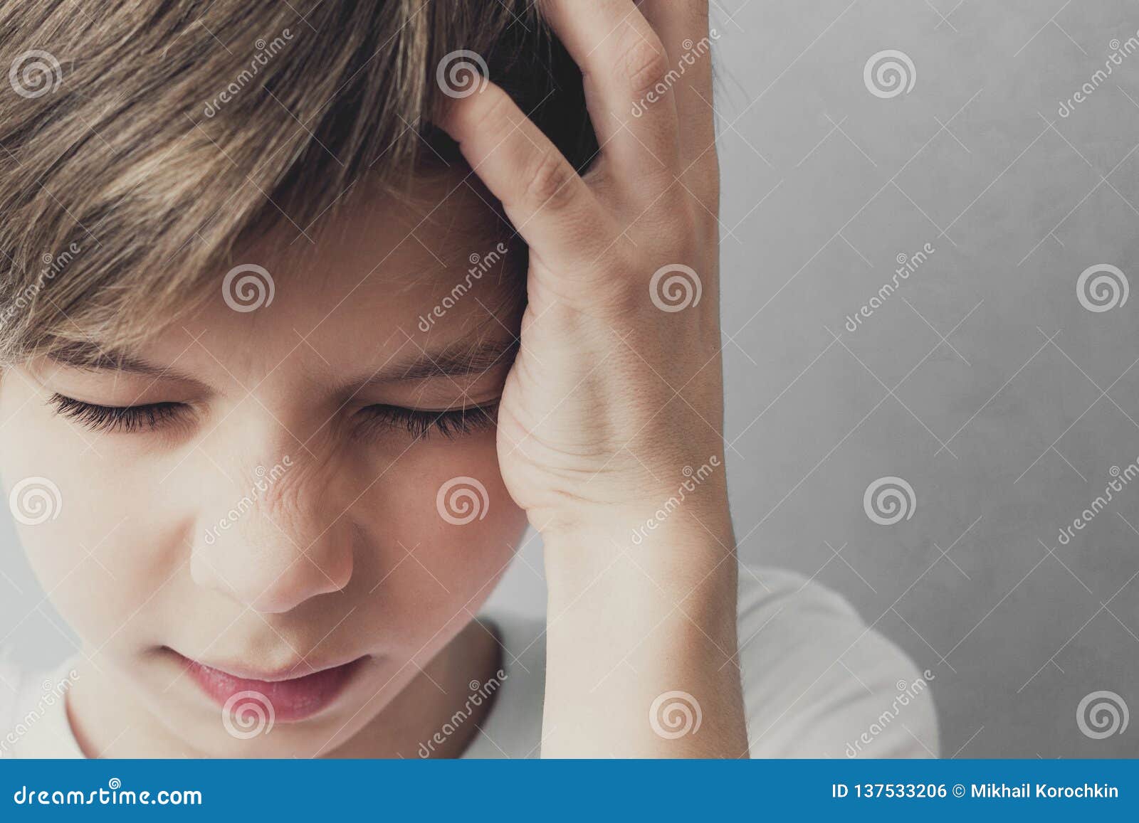 Portrait of Boy with Headache Stock Photo - Image of illness, unhappy ...