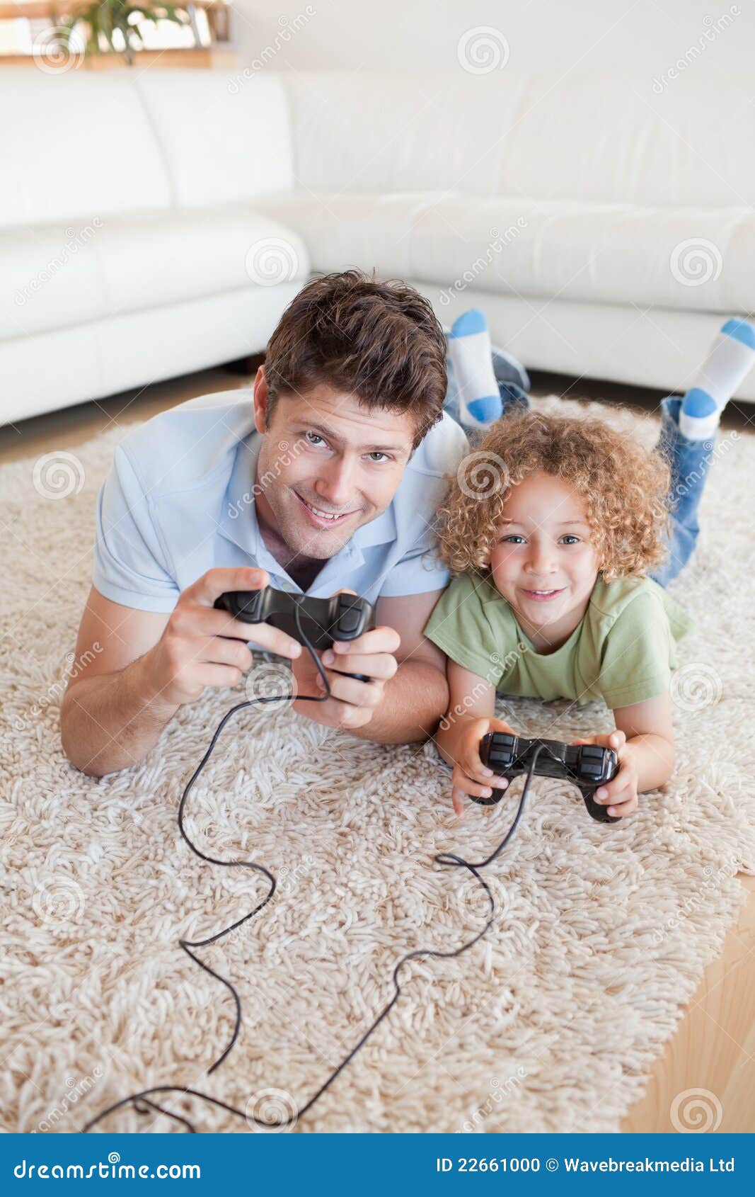 Portrait of a Boy and His Father Playing Video Games Stock Photo ...
