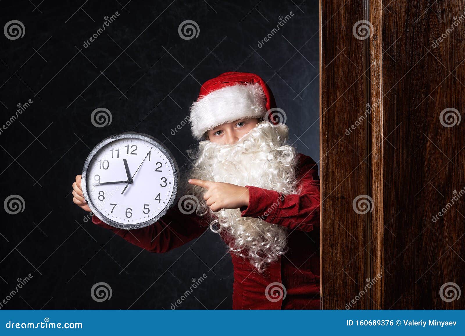 Portrait of a Boy in the Image of Santa with a Clock Indicating the ...