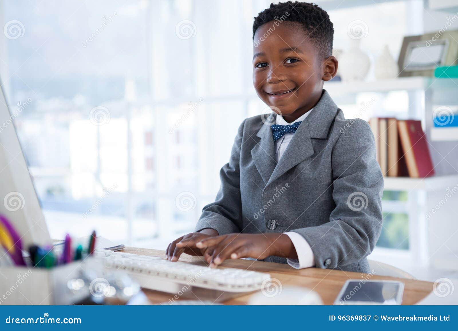 Portrait of Boy Imitating As Businessman Using Computer Stock Image ...