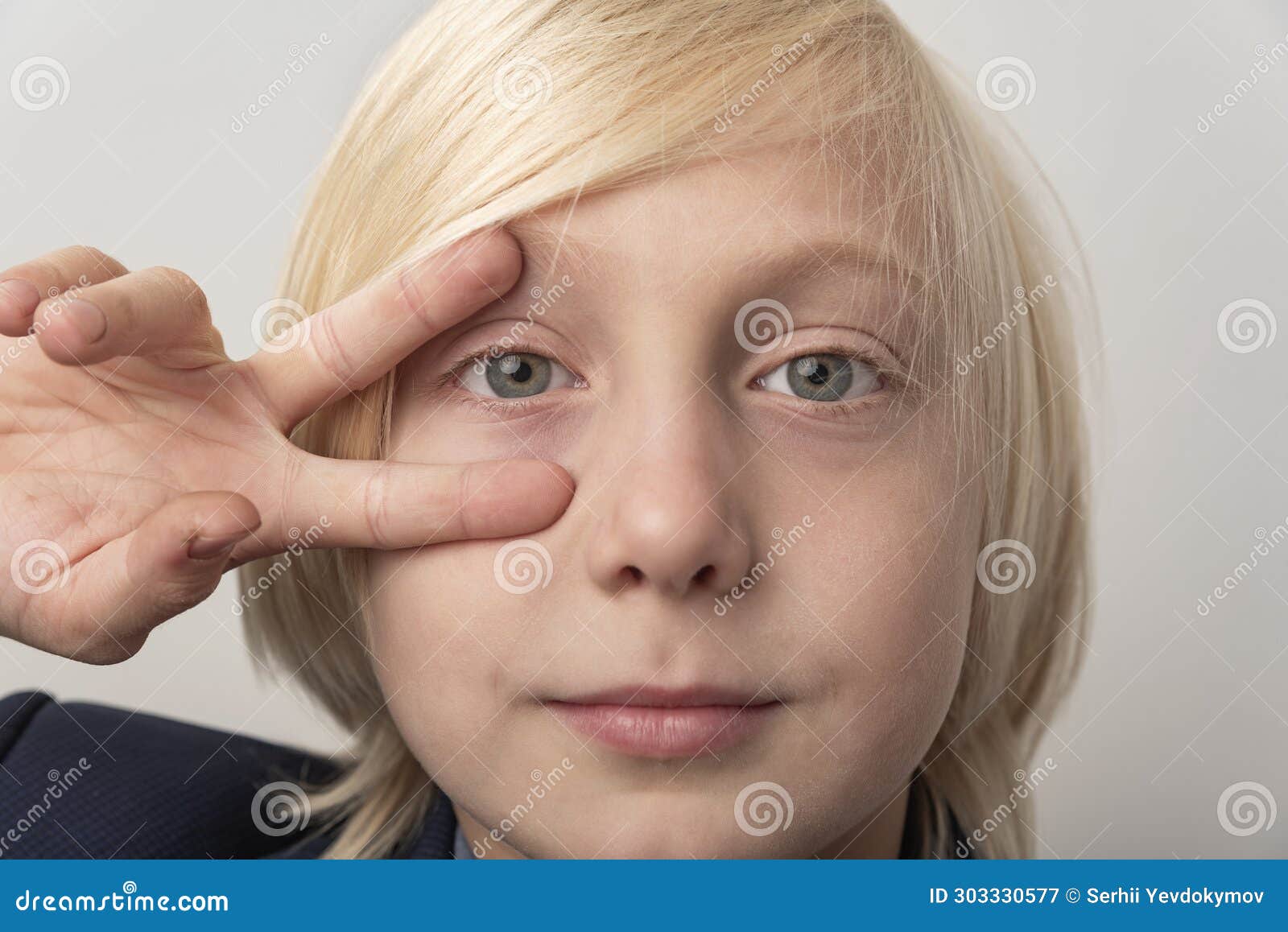 Portrait of a Boy Looking at the Camera and Showing Peace Sign Stock ...