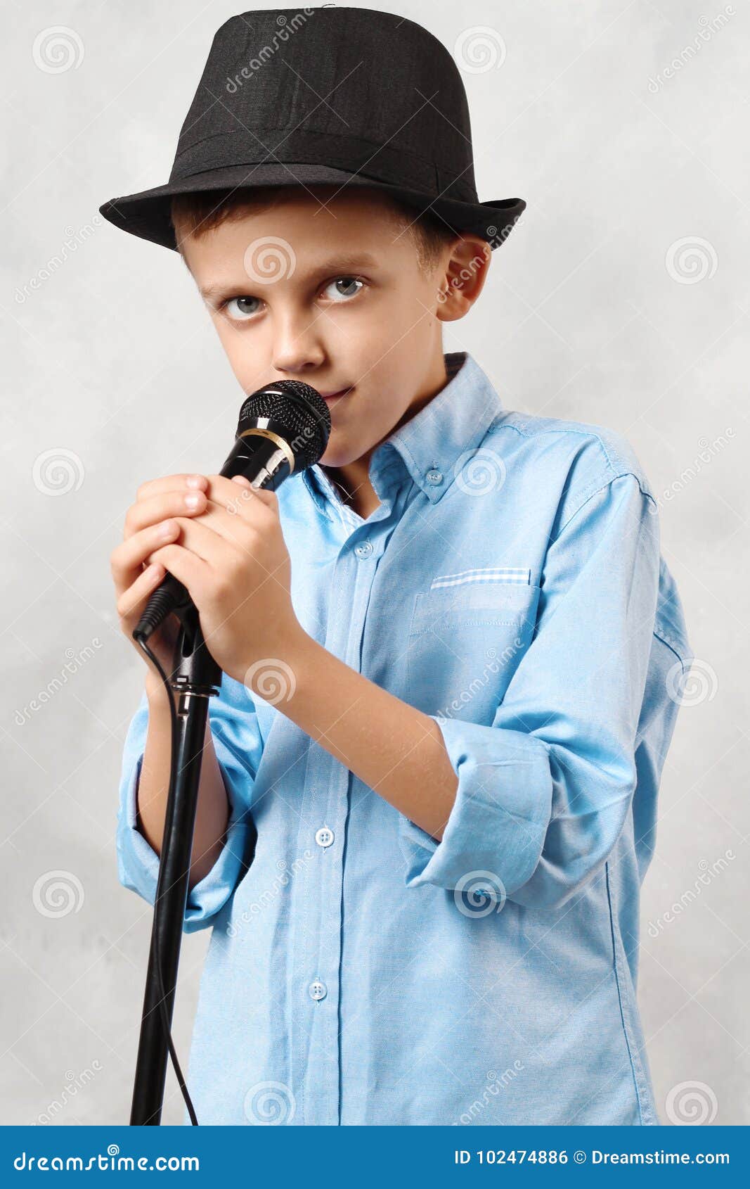 Portrait of a Boy with a Microphone Stock Photo - Image of studio ...