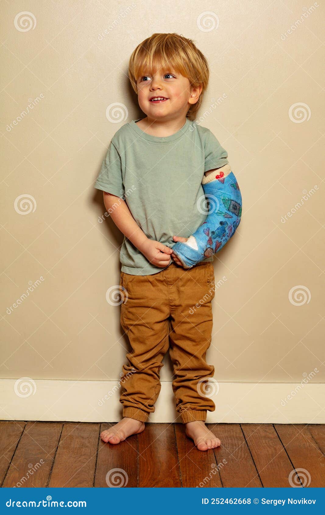 Portrait of a Boy with Positive Expression Despite Broken Hand Stock ...