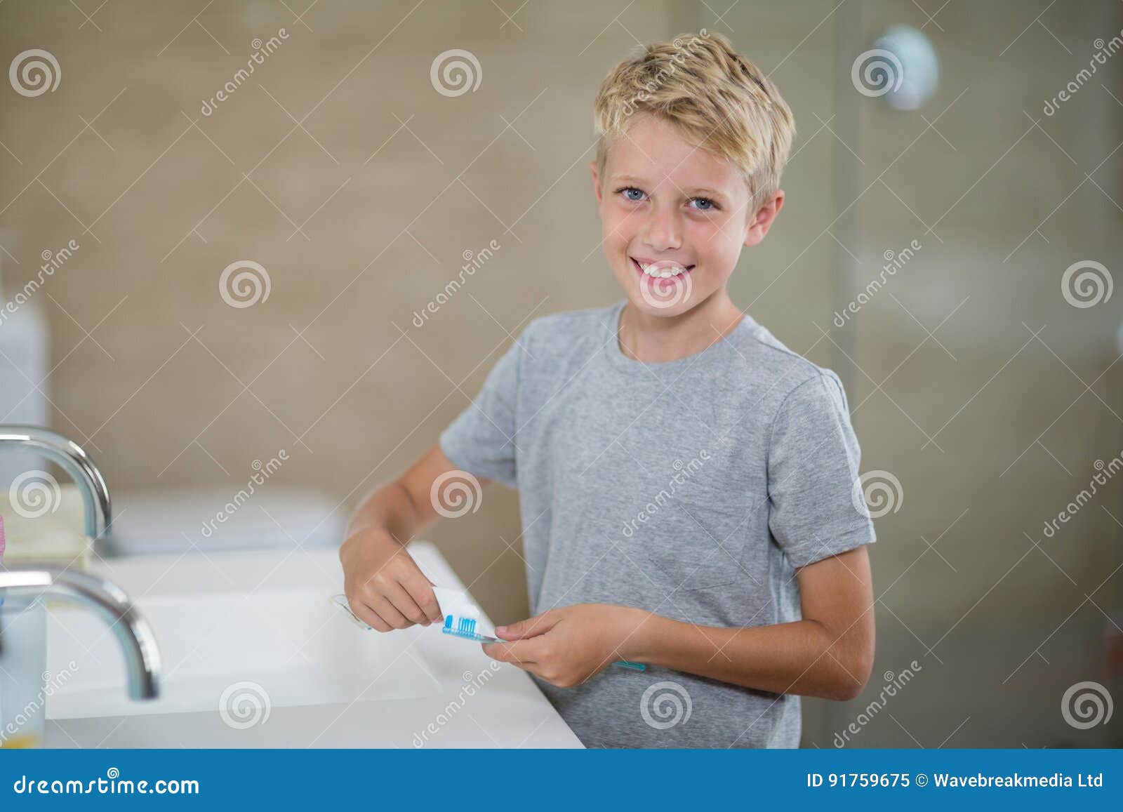 Portrait of Boy Putting Toothpaste on Brush in Bathroom Stock Image ...
