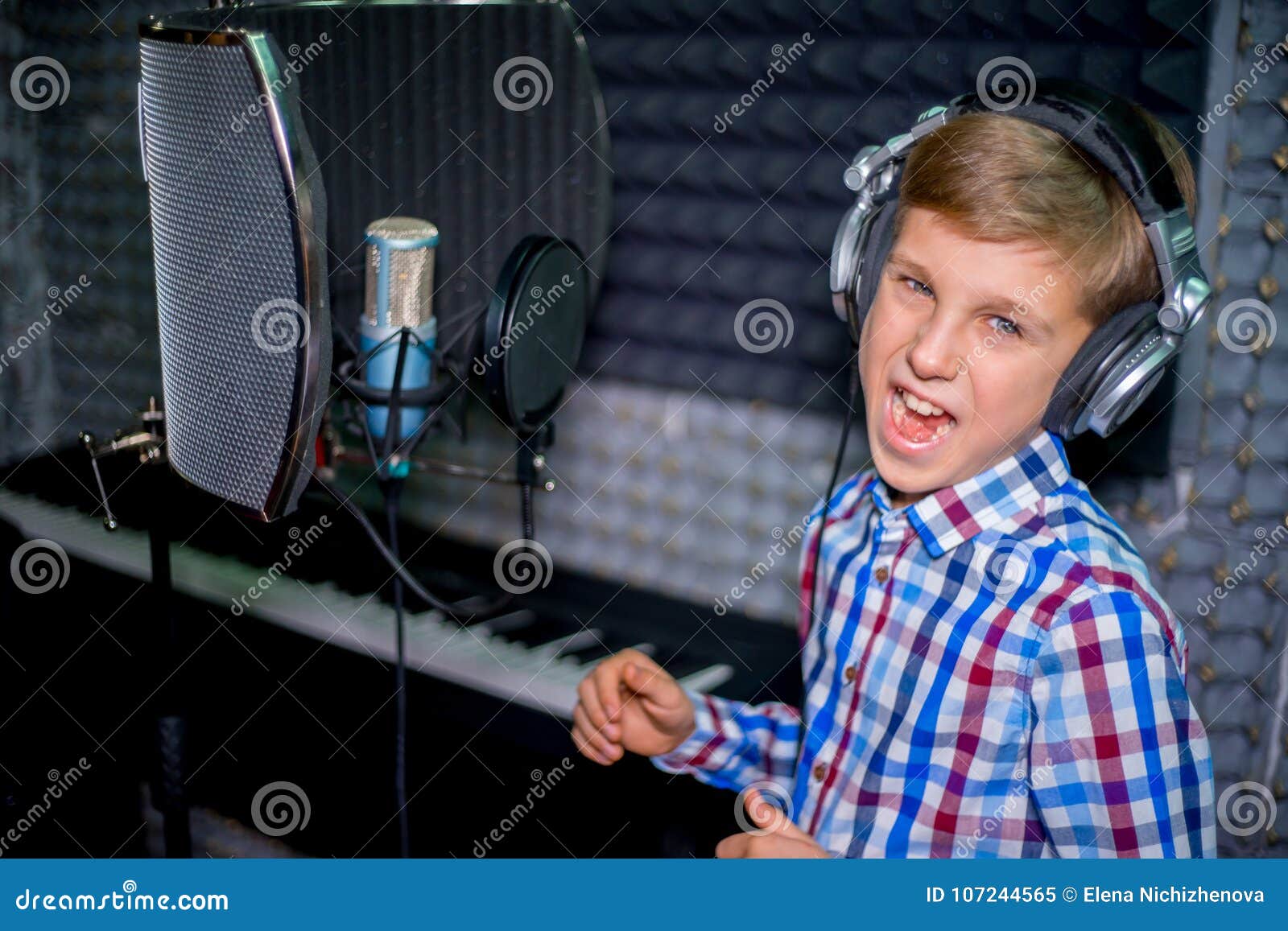 Boy in a recording studio stock image. Image of panel - 107244565
