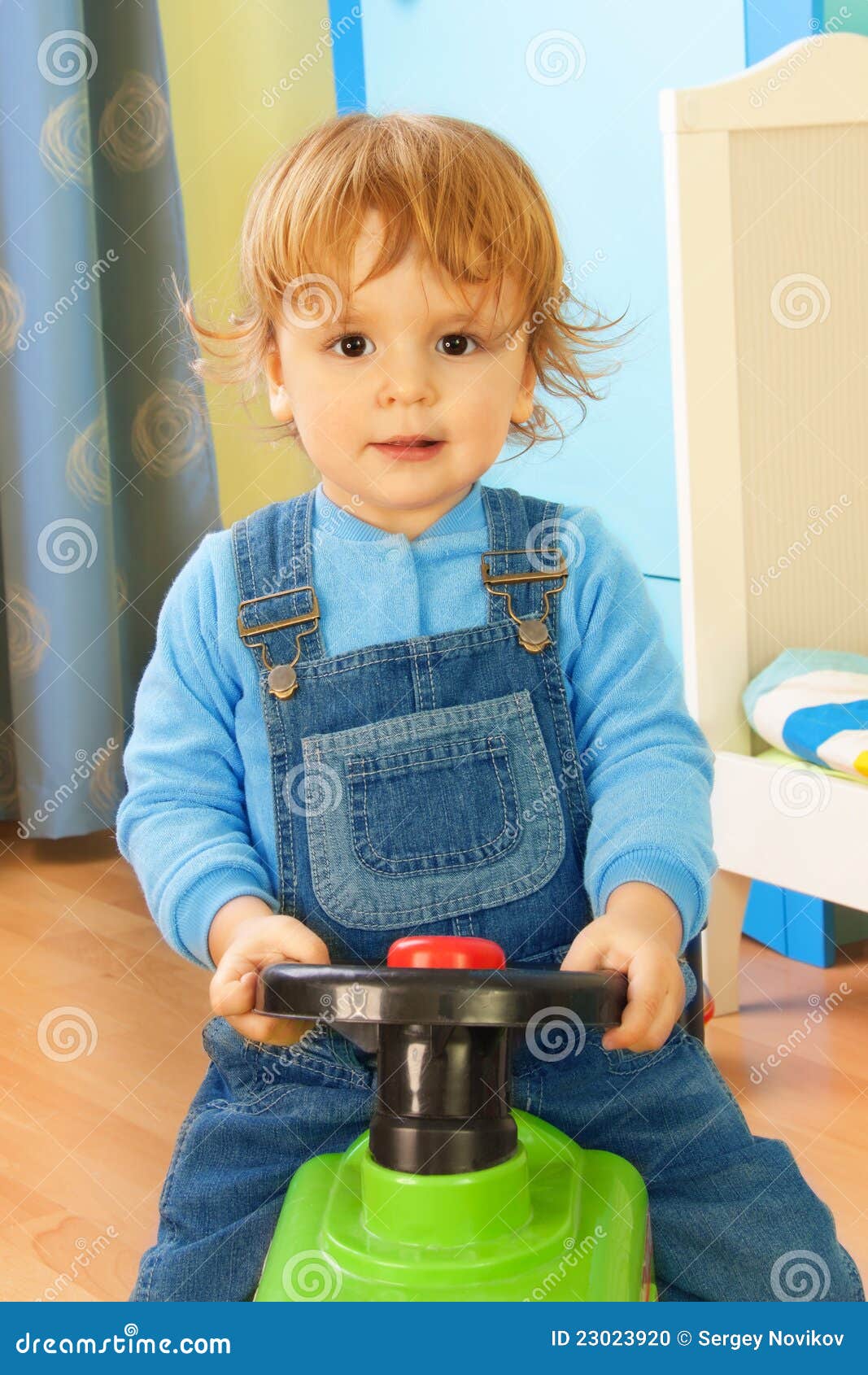 Portrait of a Boy Riding a Toy Car Stock Photo - Image of learn, person ...