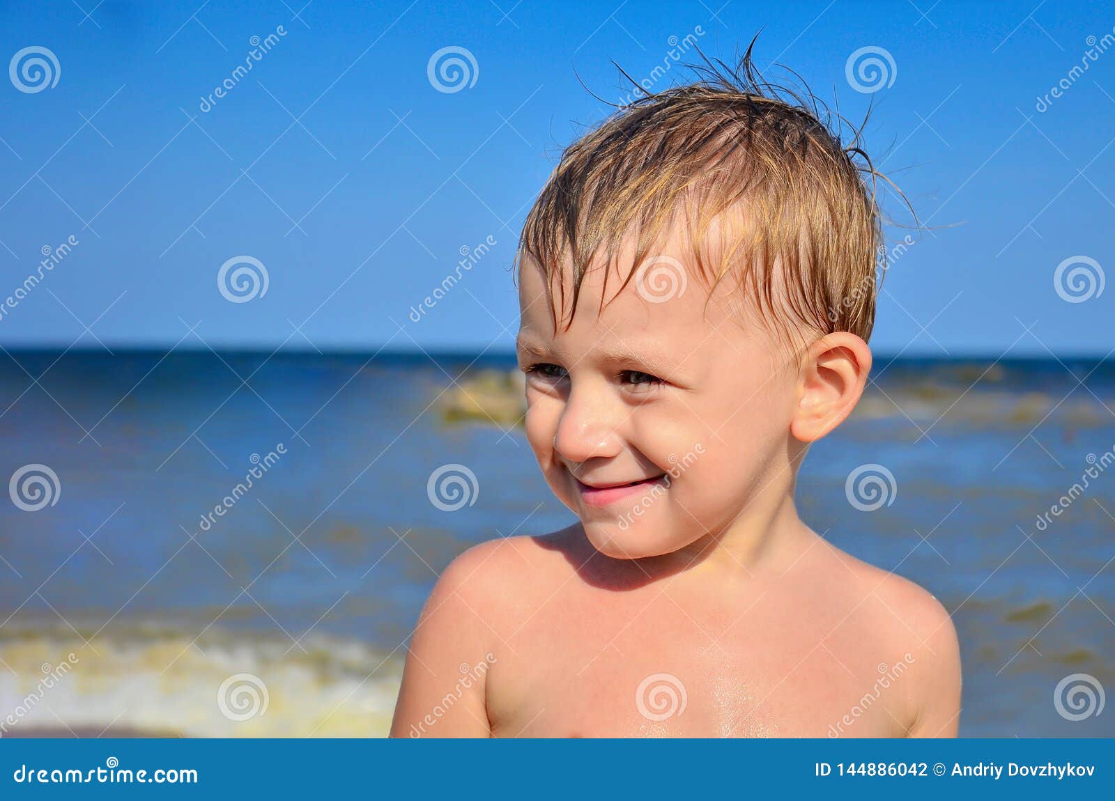 Portrait of a Boy on the Sea Against the Blue Sky Stock Photo - Image ...