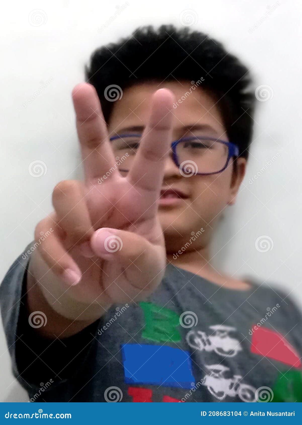 A Portrait of a Boy Showing Number Two with His Hands Stock Photo ...