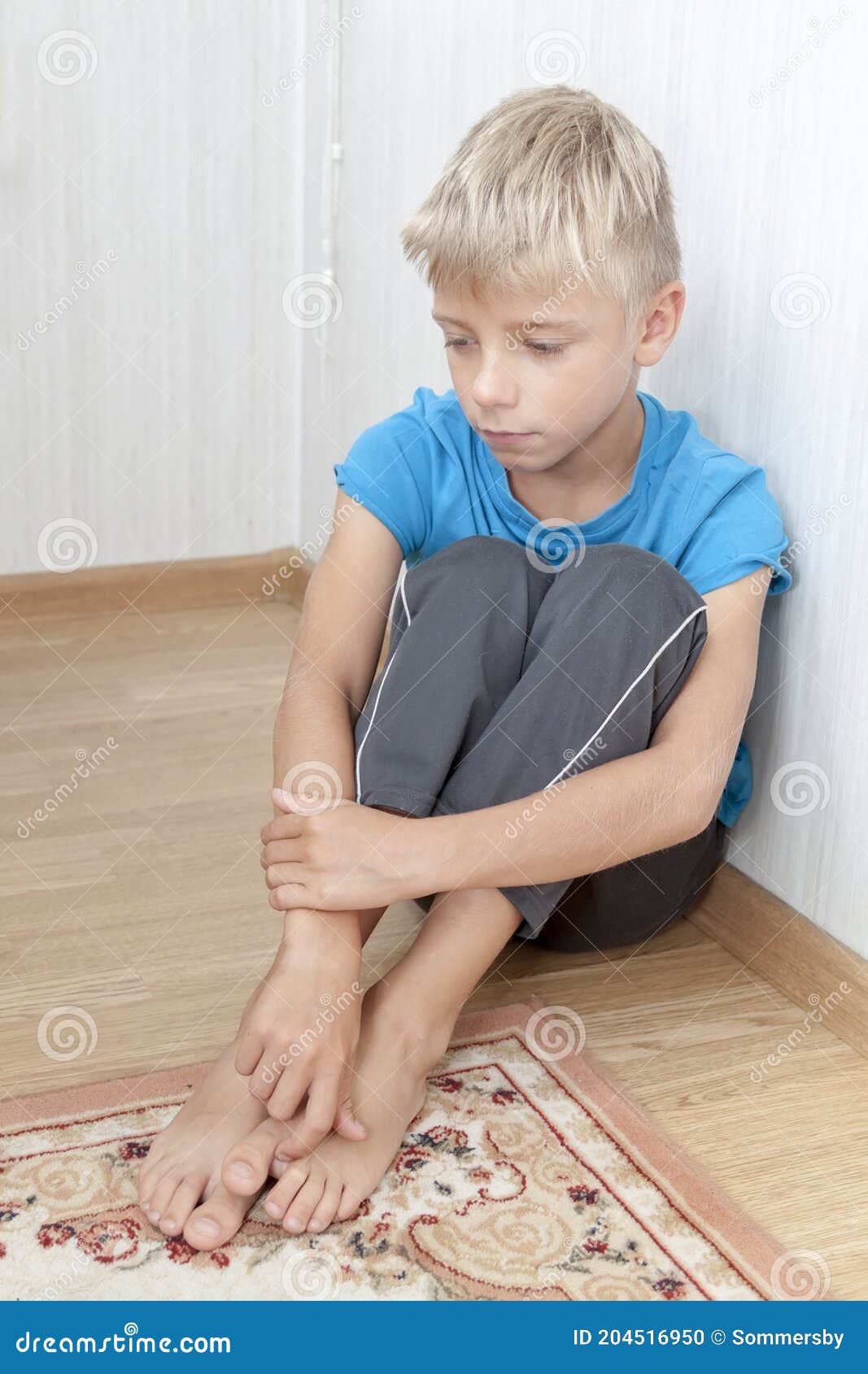 Portrait of Boy Sitting on Floor Looking Away Calm Upset Deep in ...