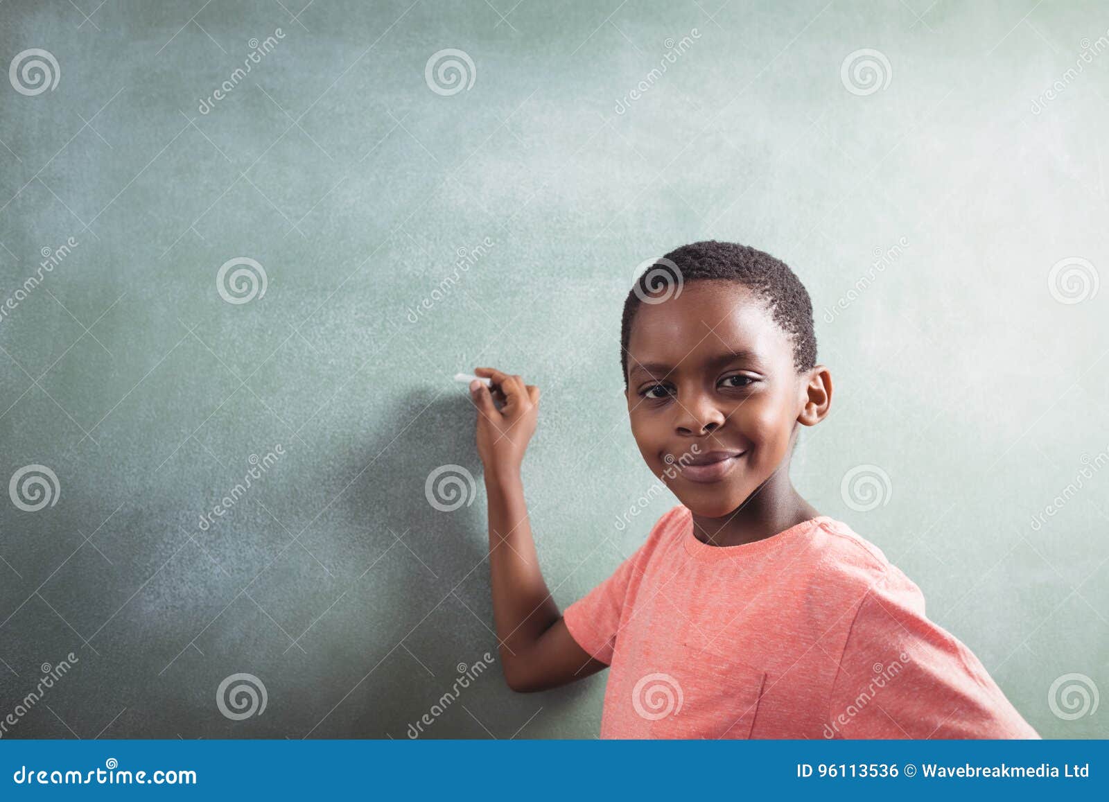 Portrait of Boy Standing by Chalkboard Stock Photo - Image of length ...
