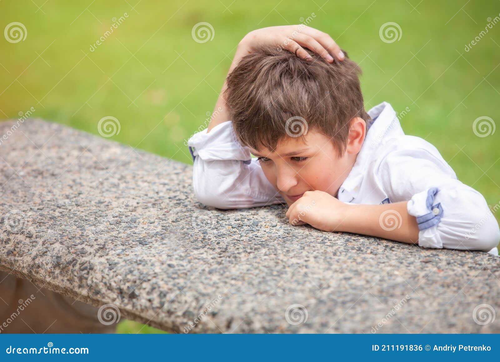 Brooding Boy in the Park Outdoors Stock Photo - Image of isolated ...