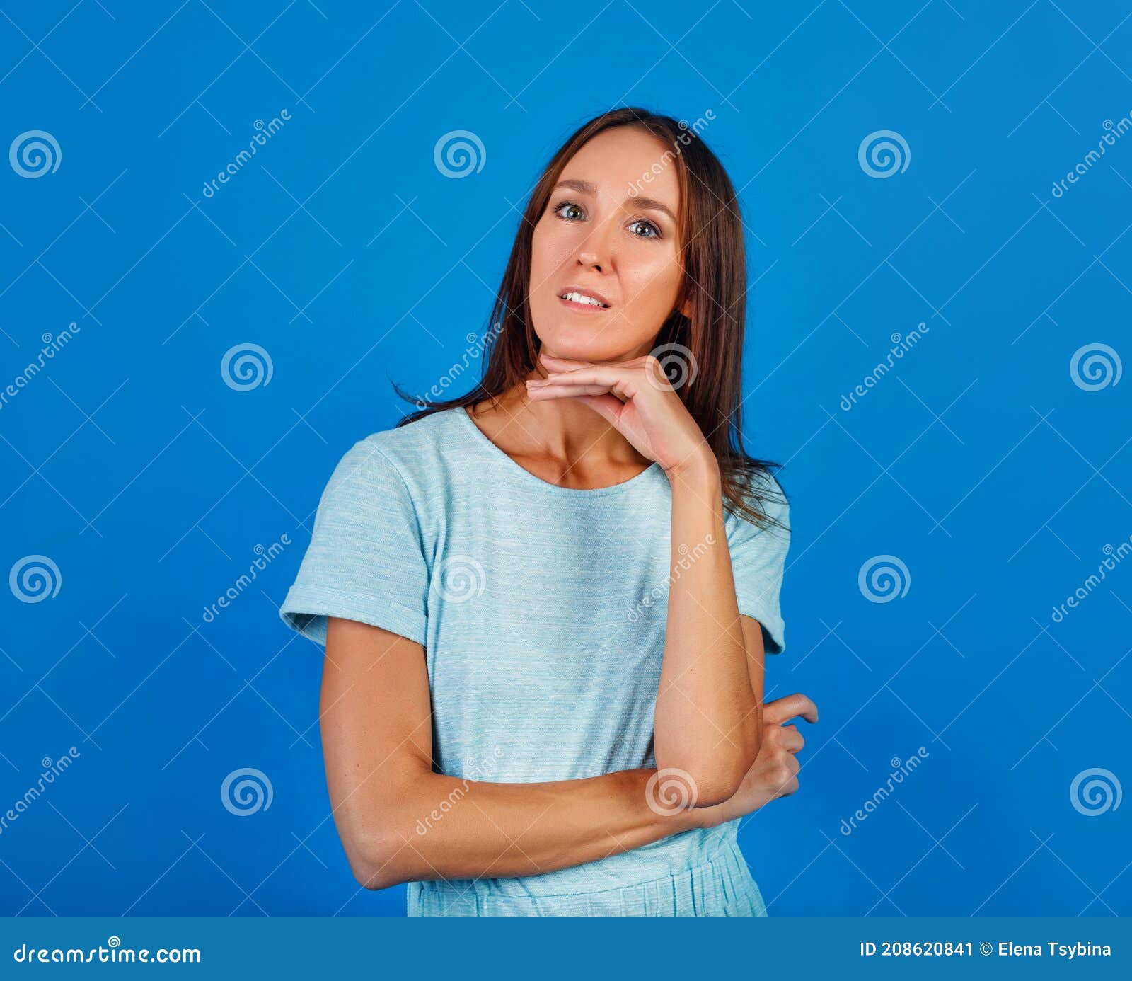 Portrait of a Brooding Brunette in a Blue T-shirt, Looking into an ...
