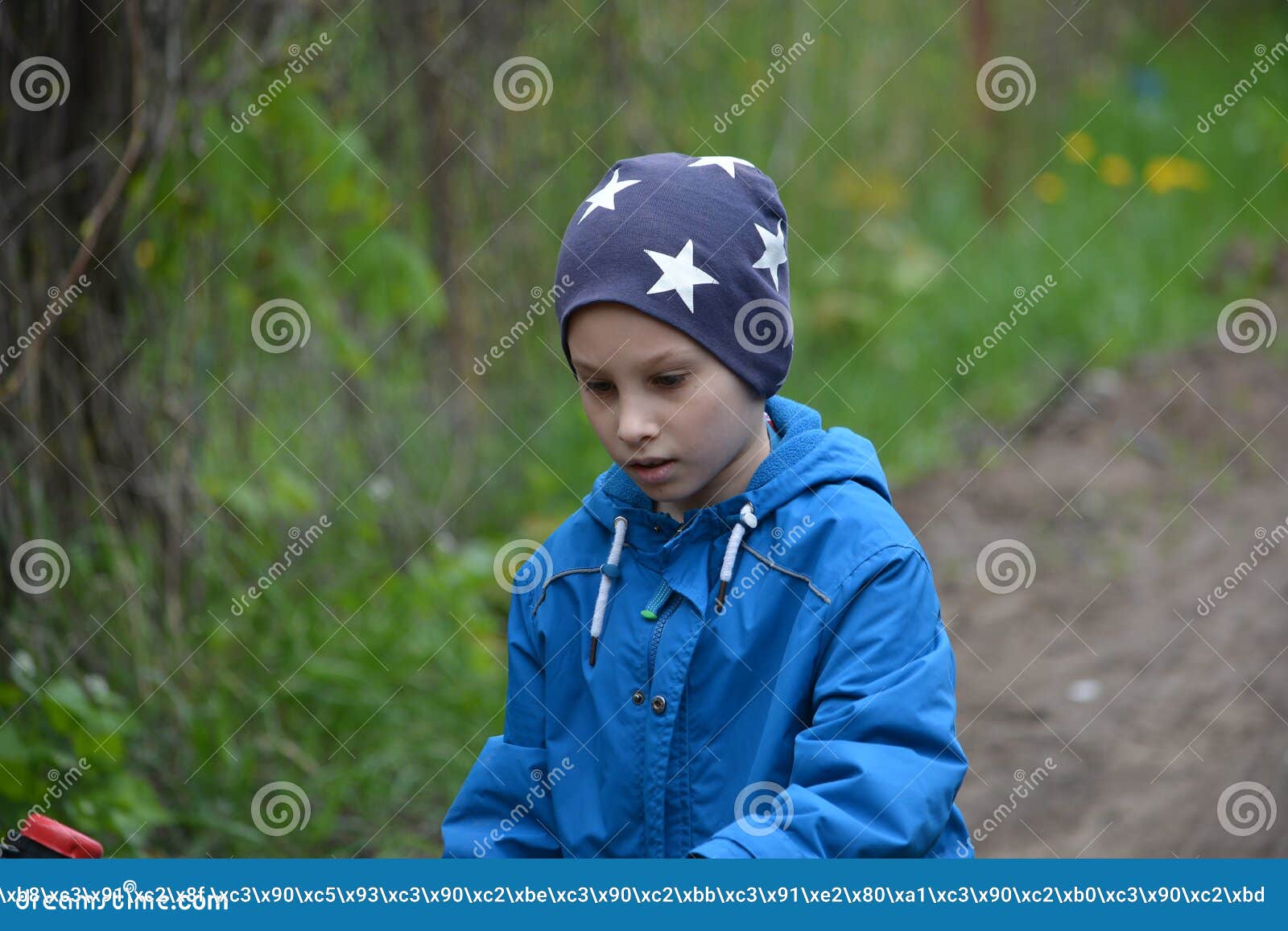 Portrait of a Brooding Child of Seven in a Blue Jacket Looking Down ...
