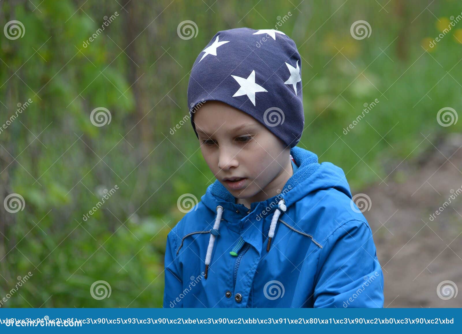 Portrait of a Brooding Child of Seven in a Blue Jacket Looking Down ...