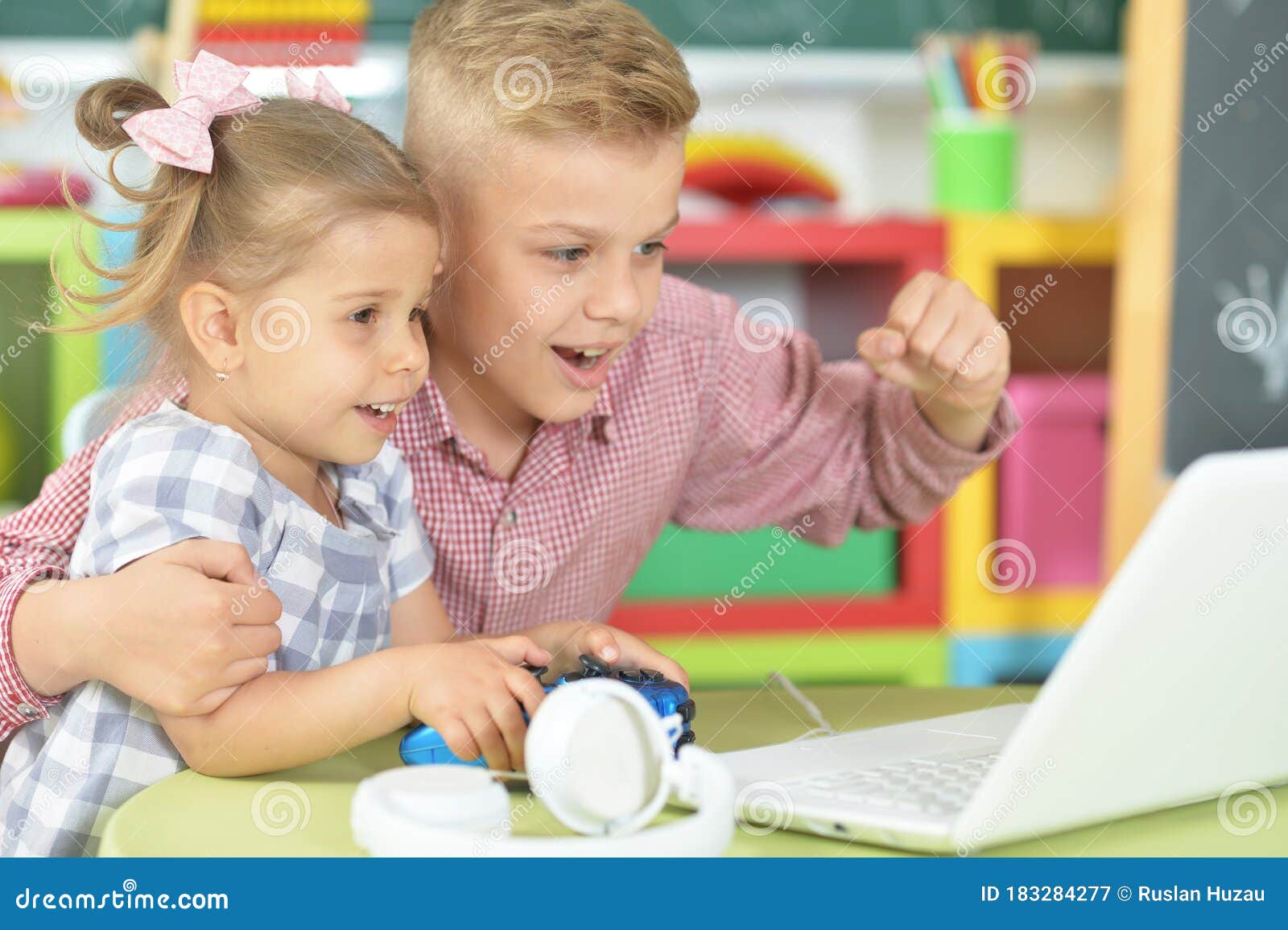 Portrait of Brother and Sister Playing Computer Game with Joystick ...