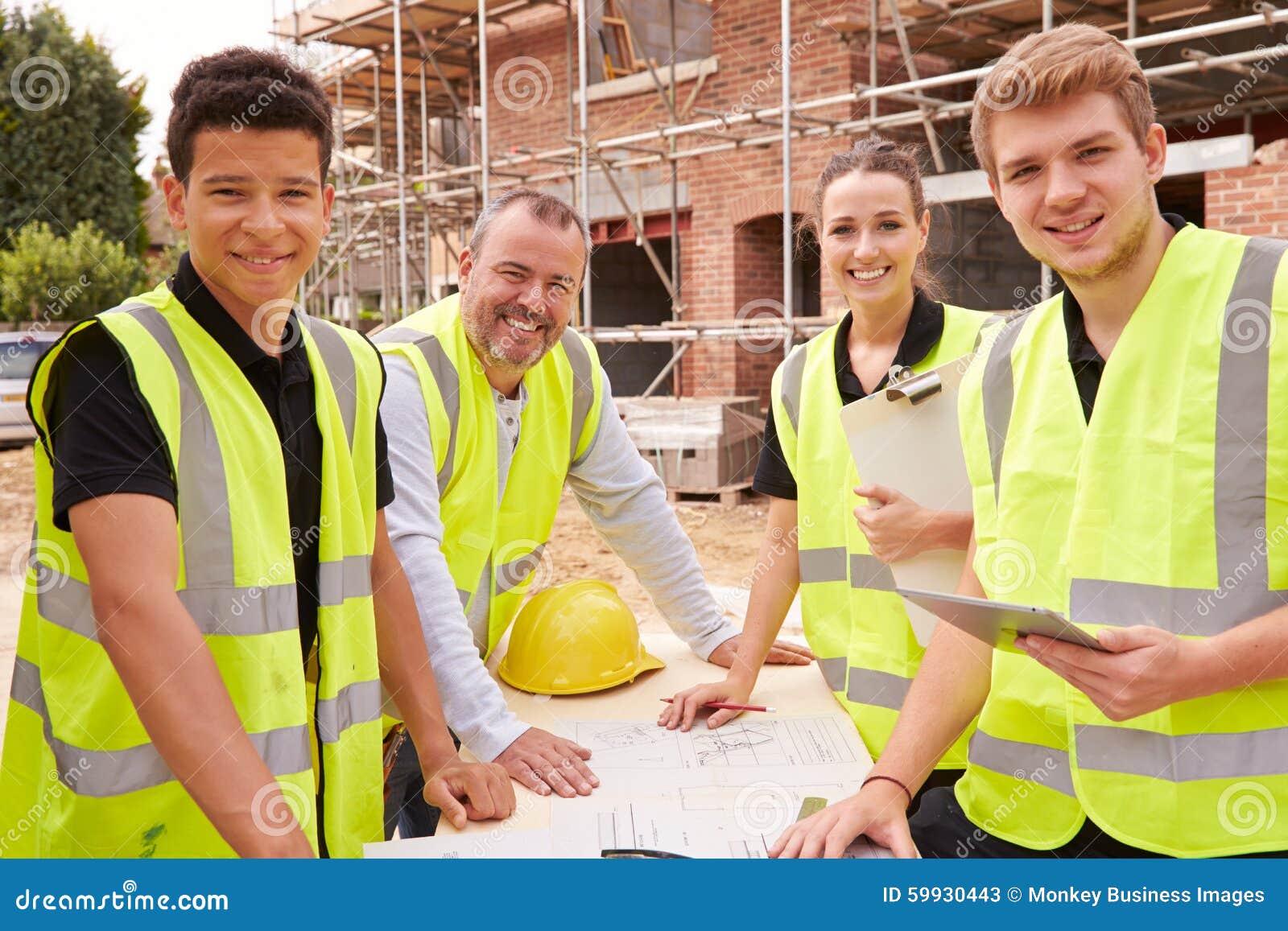 Portrait of Builder on Building Site with Apprentices Stock Image ...
