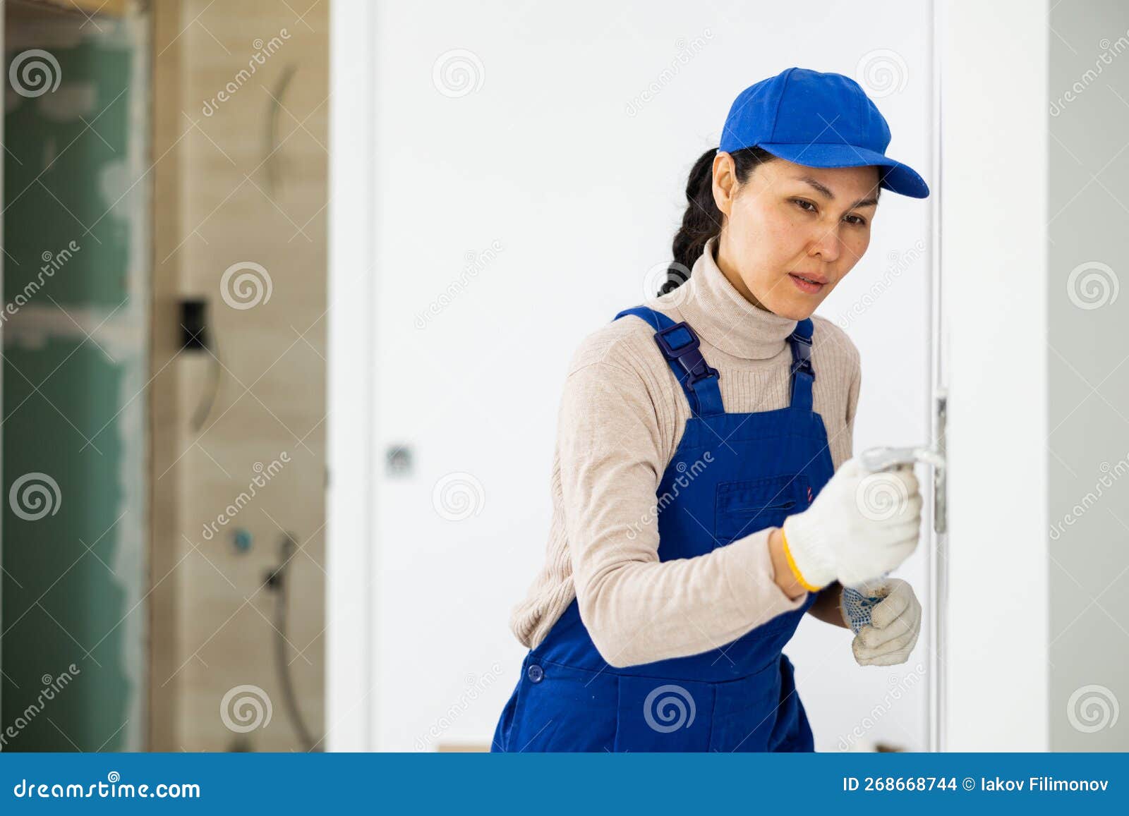 Portrait of Female Builder in Process of Finishing Work in Cottage ...