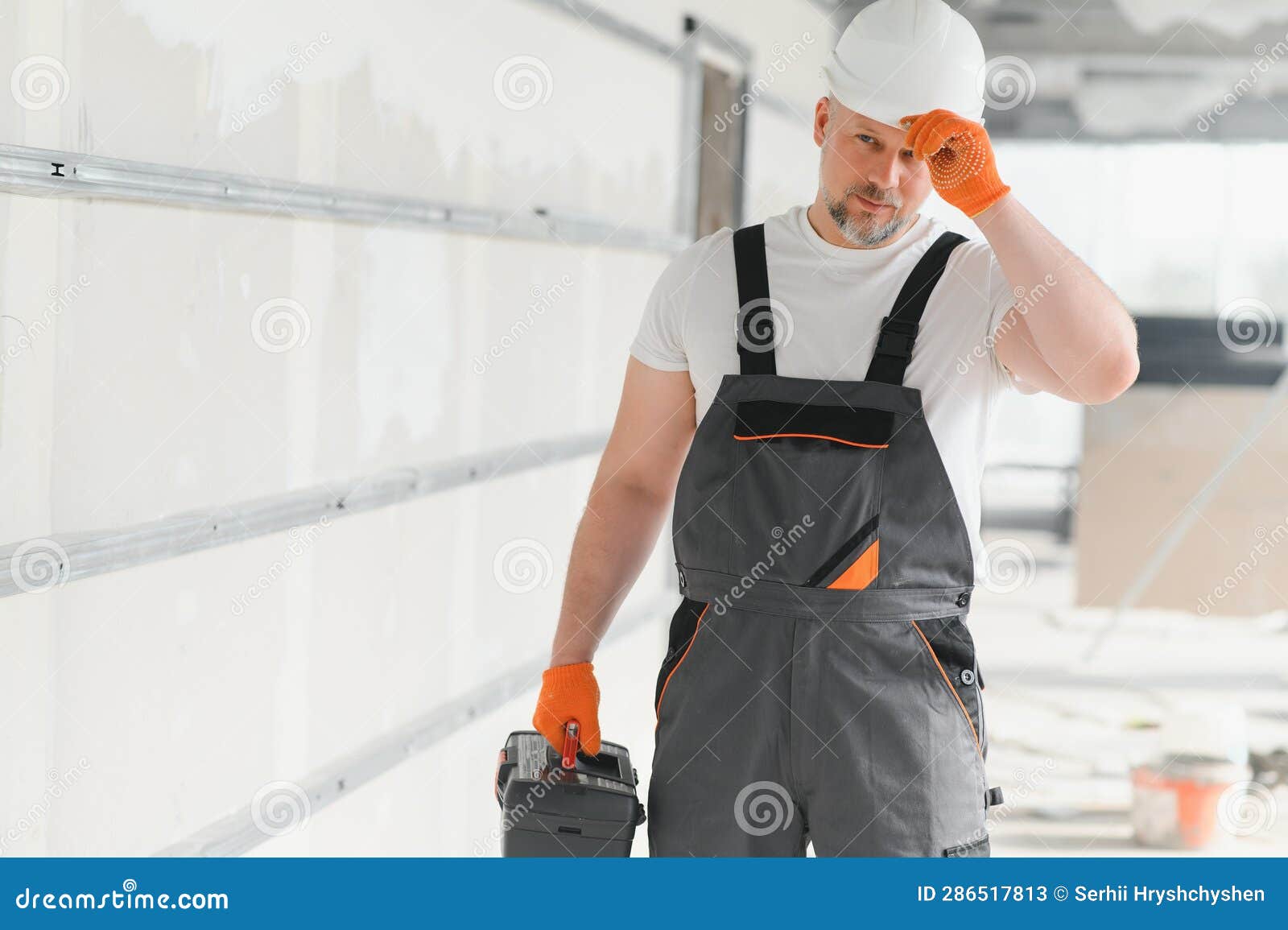 Portrait of a Builder in the Process of Working on a Construction Site ...