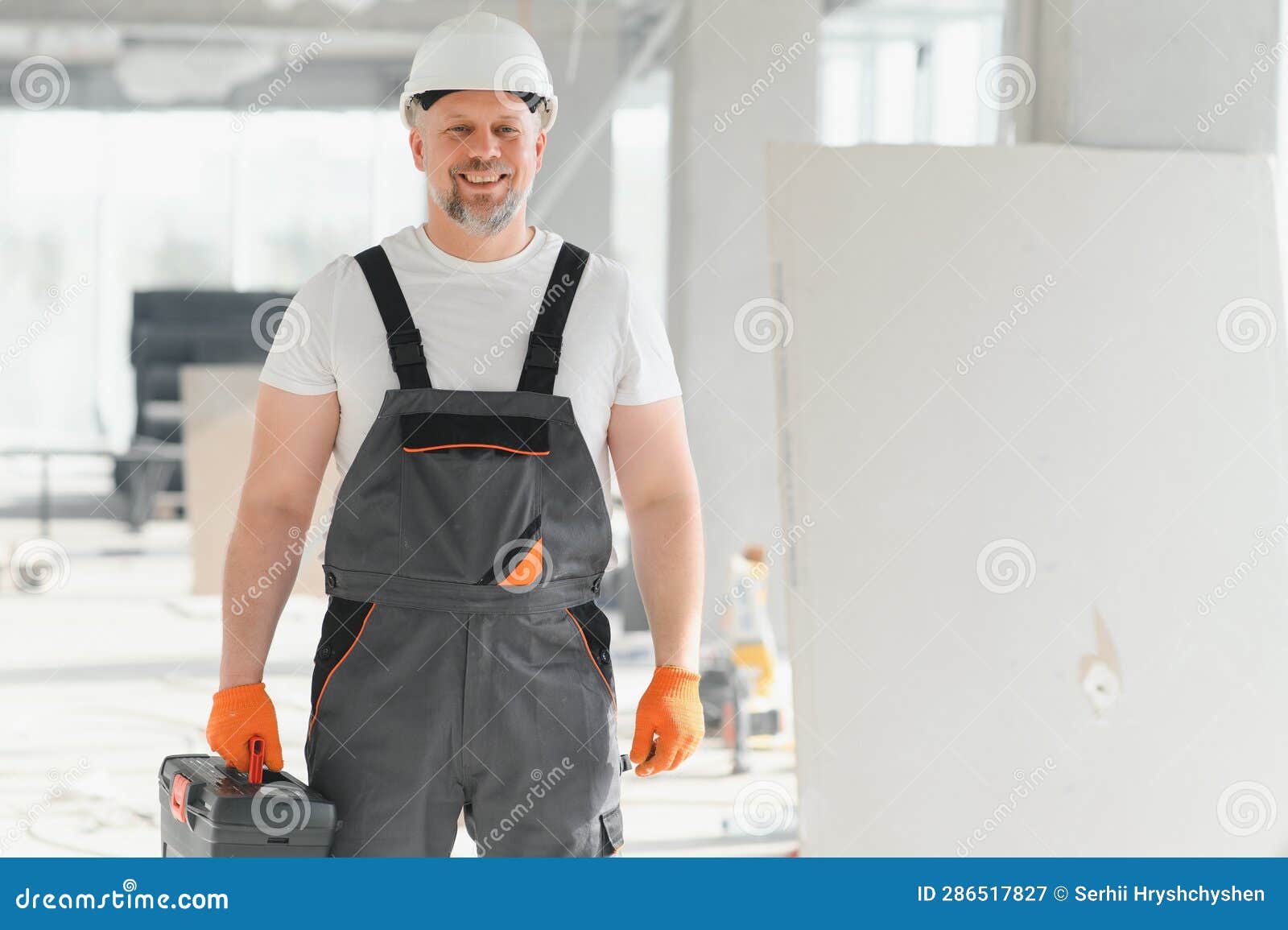 Portrait of a Builder in the Process of Working on a Construction Site ...