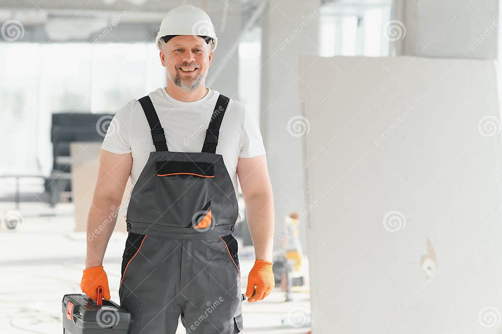 Portrait of a Builder in the Process of Working on a Construction Site ...