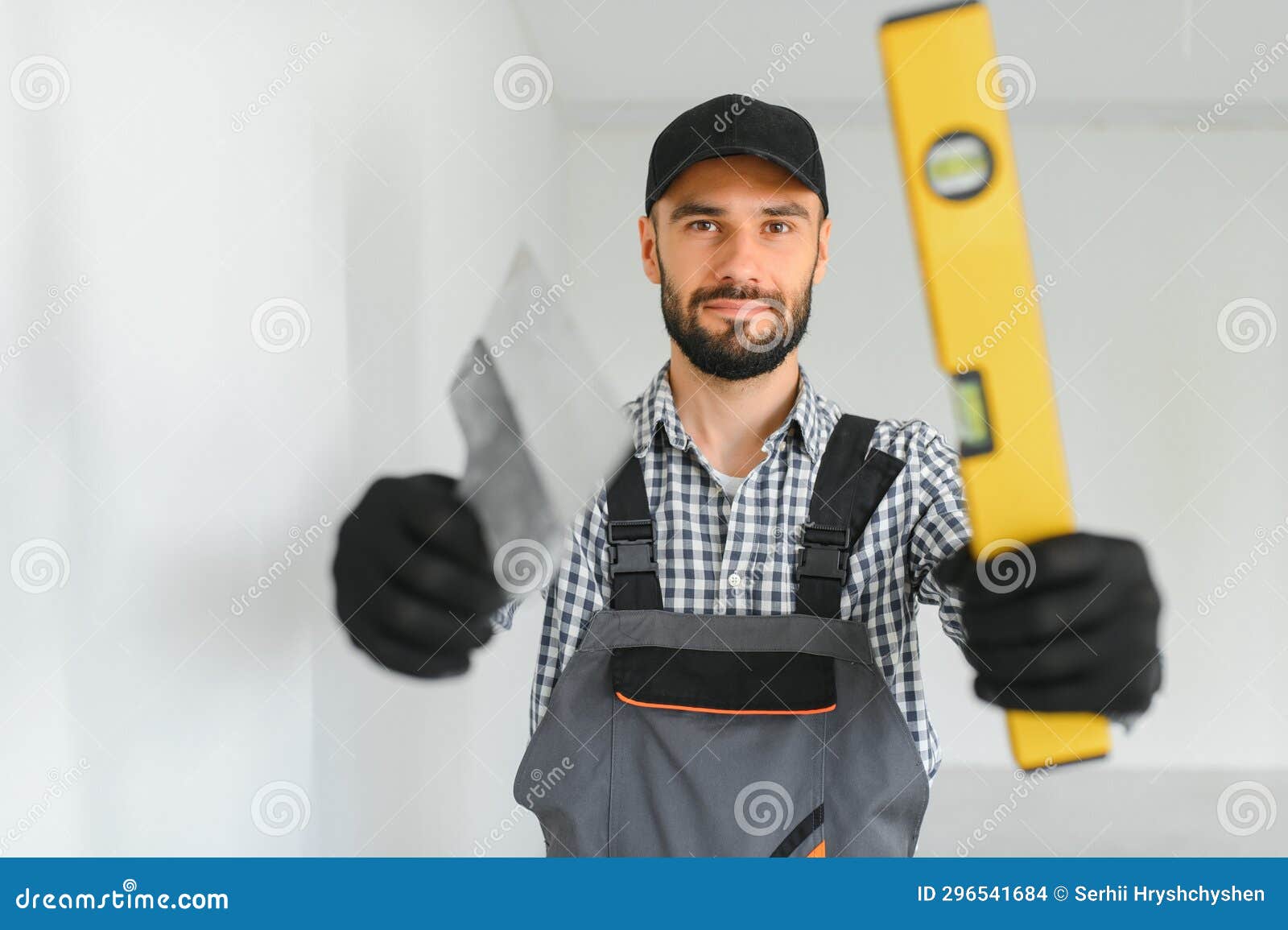 Portrait of a Builder in the Process of Working on a Construction Site ...