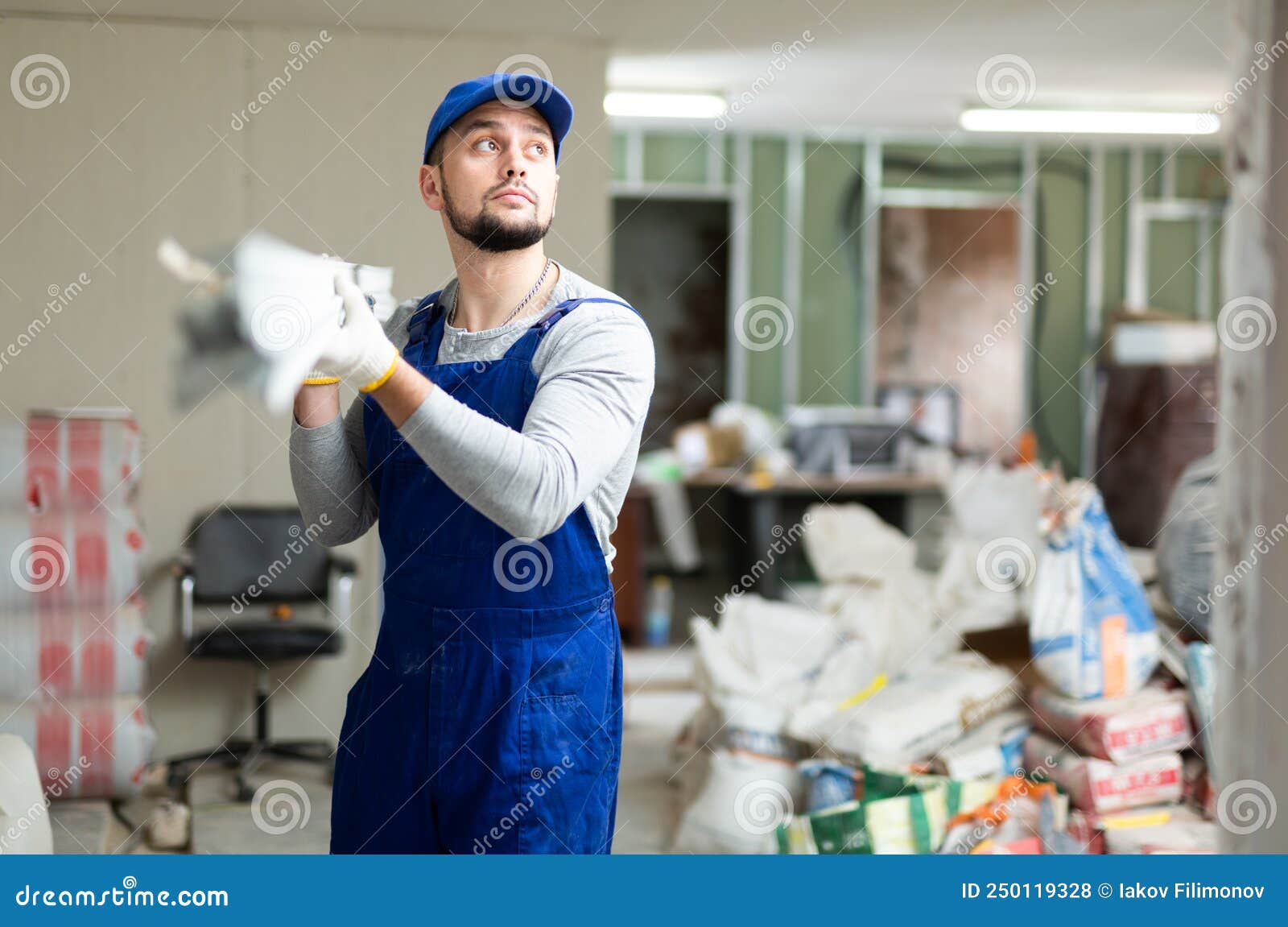 Portrait of a Builder in the Process of Working on a Construction Site ...