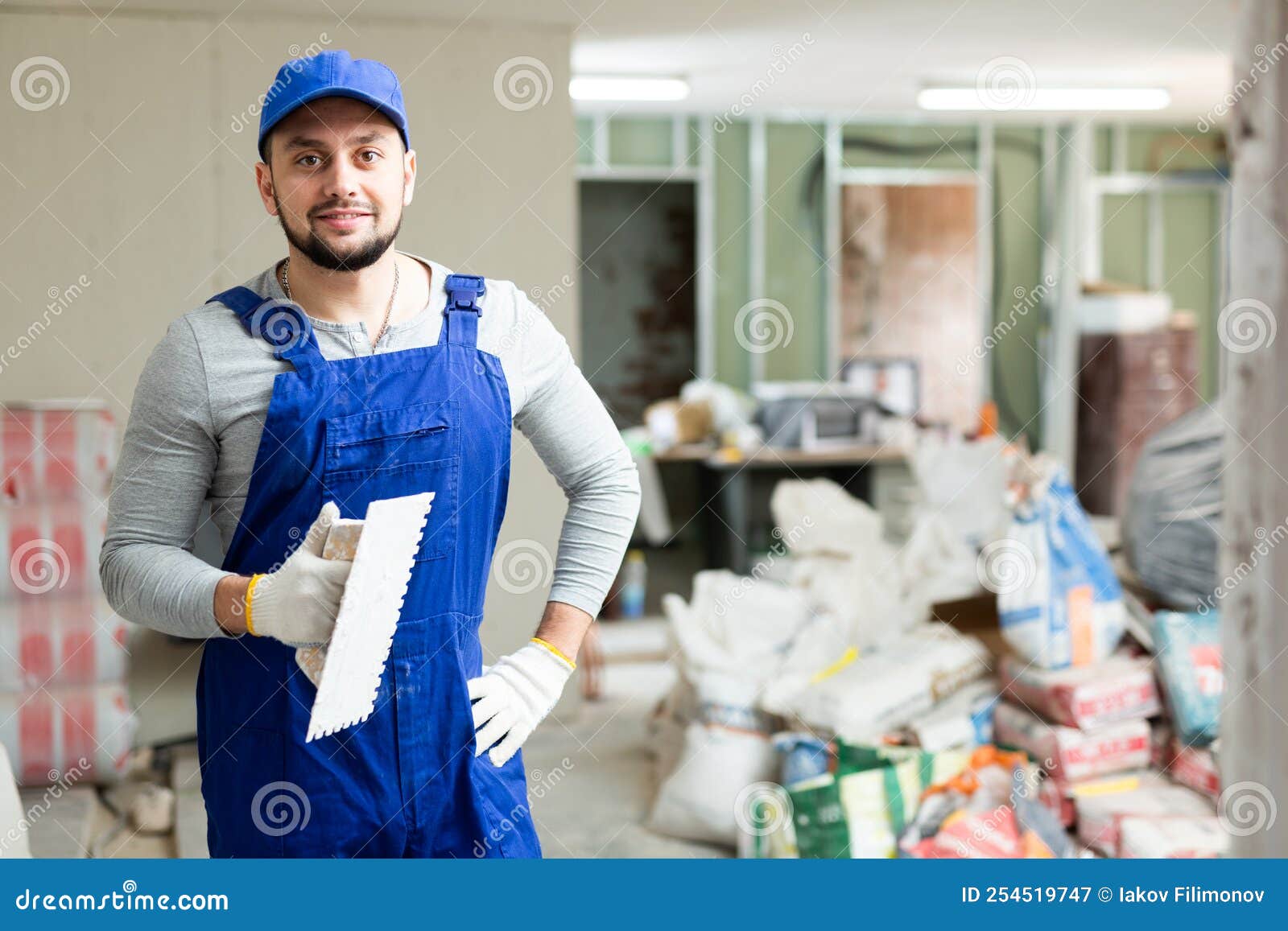 Portrait of a Builder in the Process of Working on a Construction Site ...