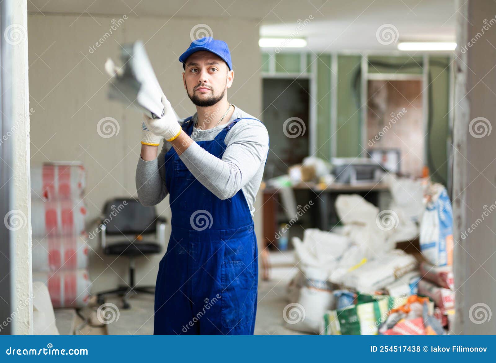 Portrait of a Builder in the Process of Working on a Construction Site ...
