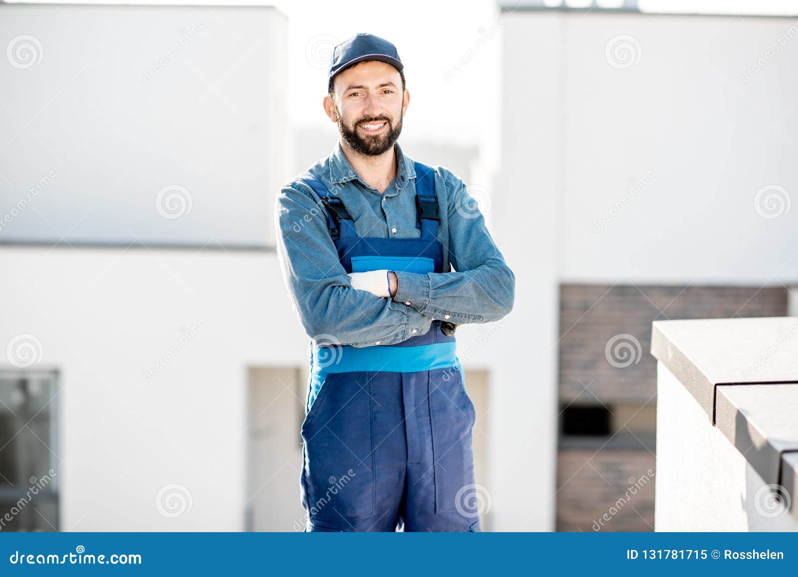 Portrait of a Builder in Uniform on the Roof Stock Image - Image of ...