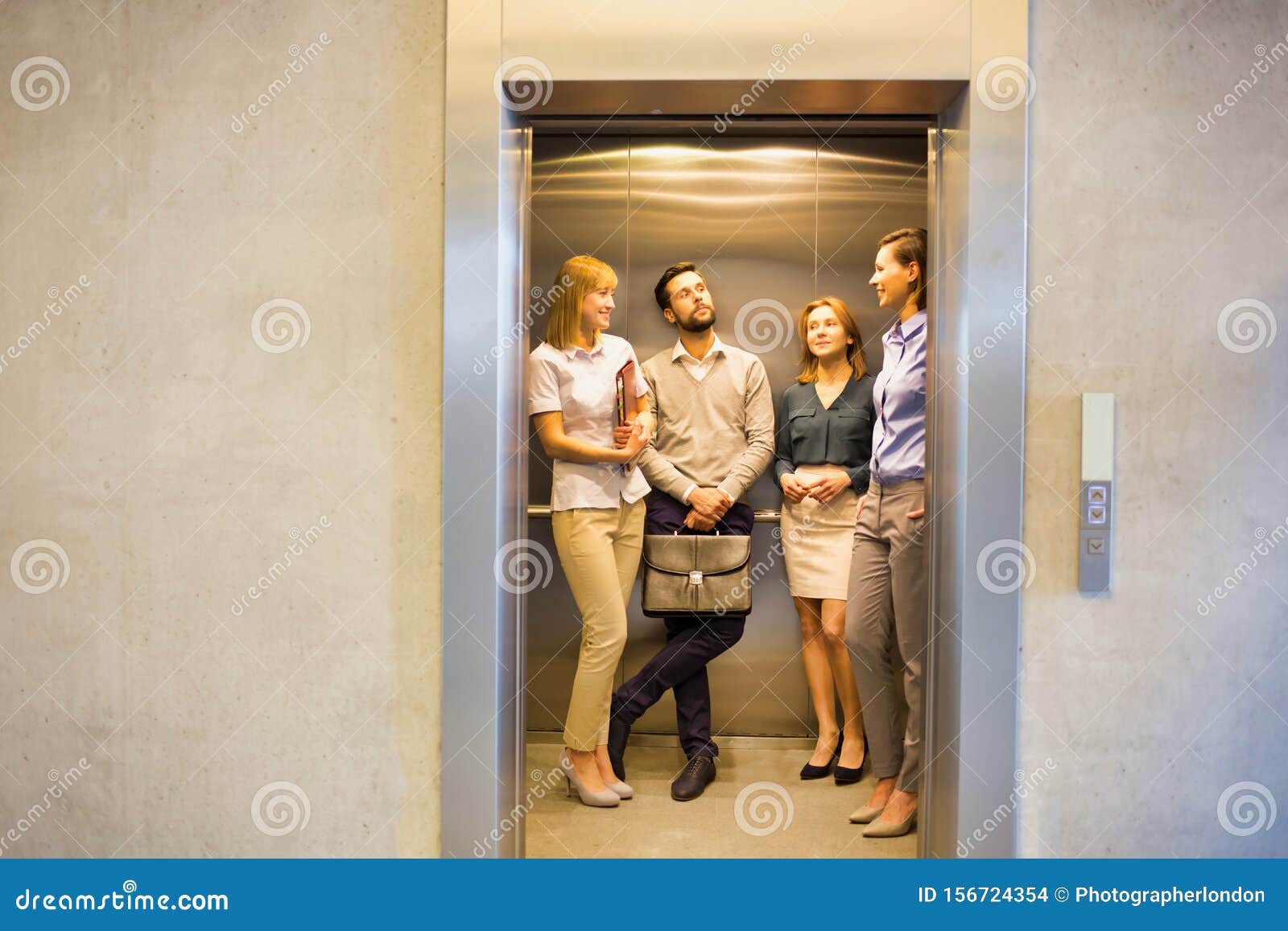 Business People Waiting for Elevator Stock Photo - Image of gesturing ...