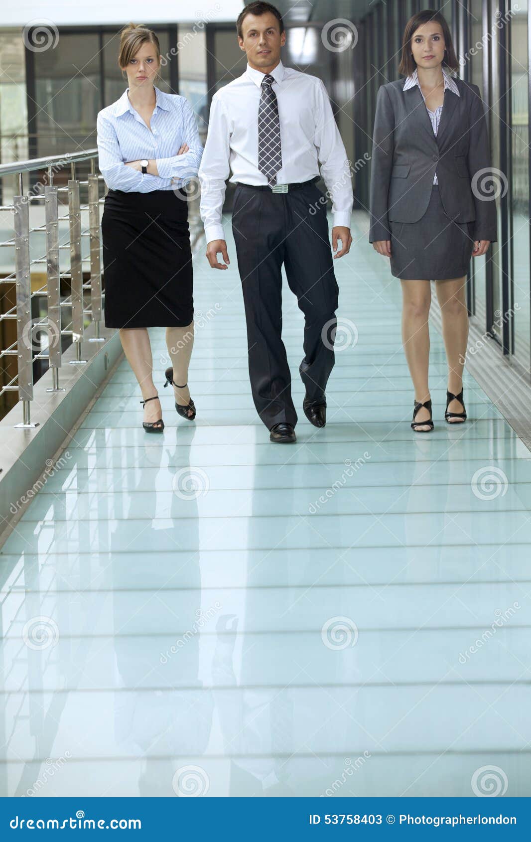 Portrait of Business People Walking on Corridor at Office Stock Image ...