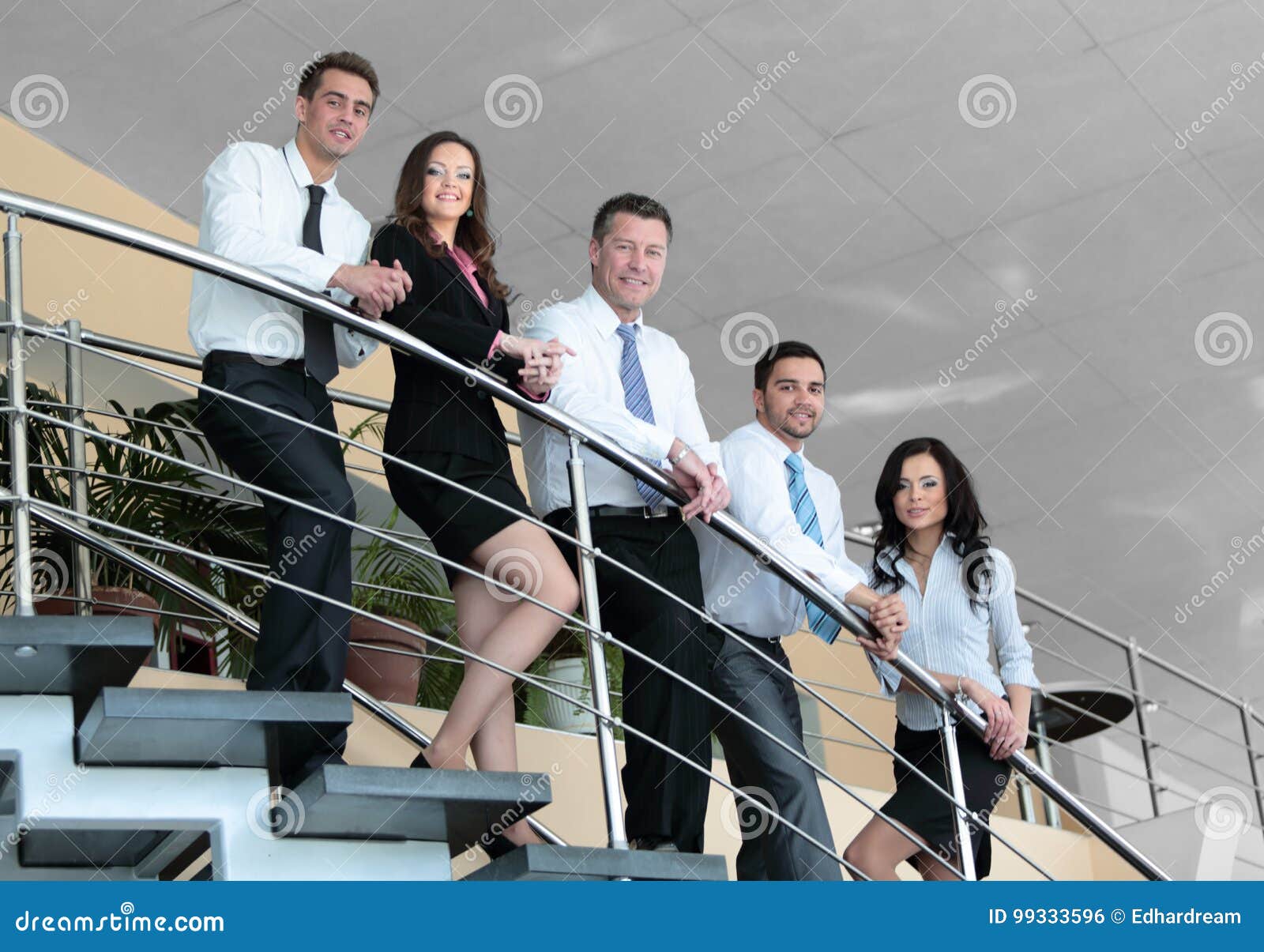 Portrait of Business People Standing on the Steps of Stairs Stock Photo ...
