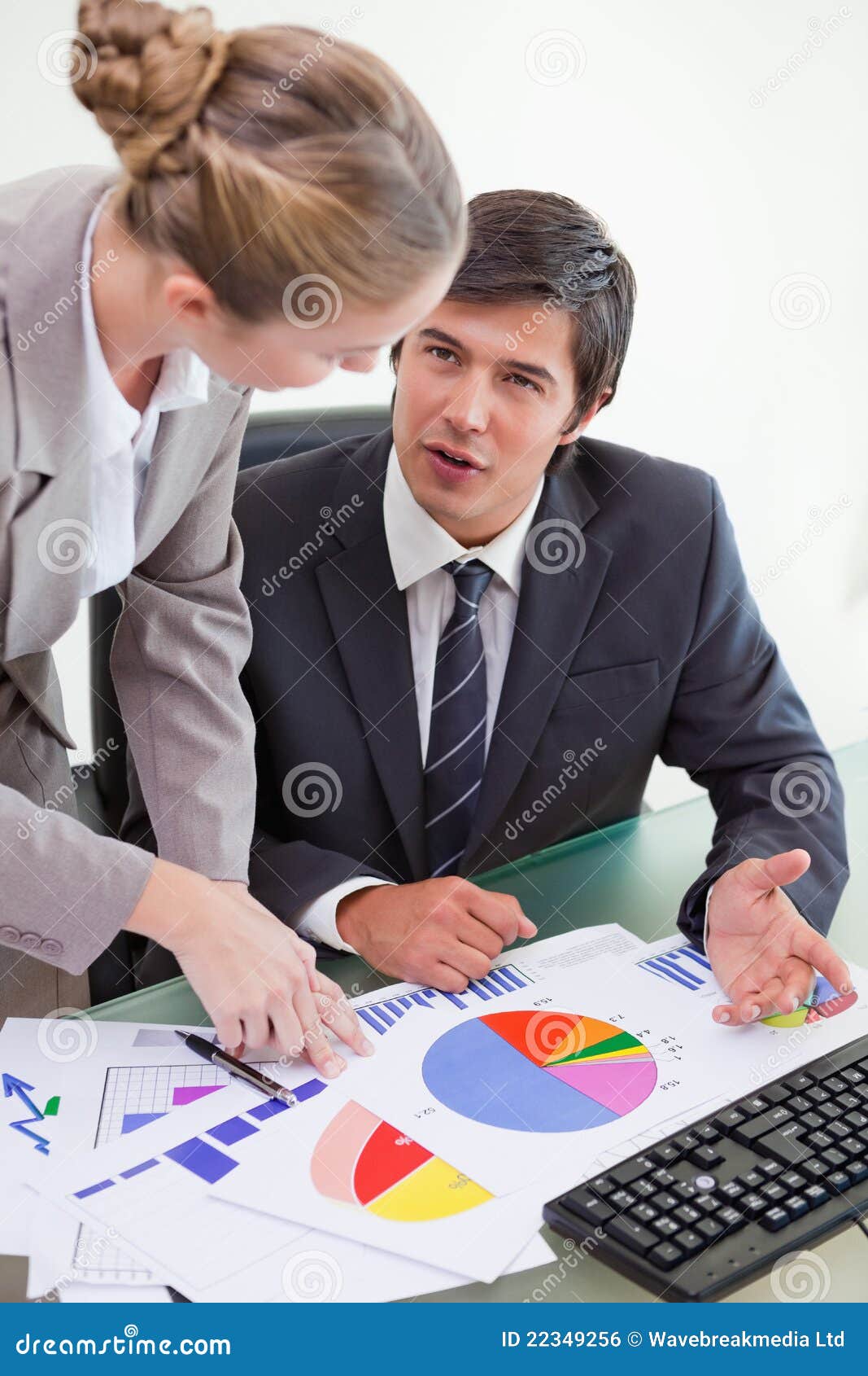 Portrait of a Business Team Studying Statistics with a Computer Stock ...
