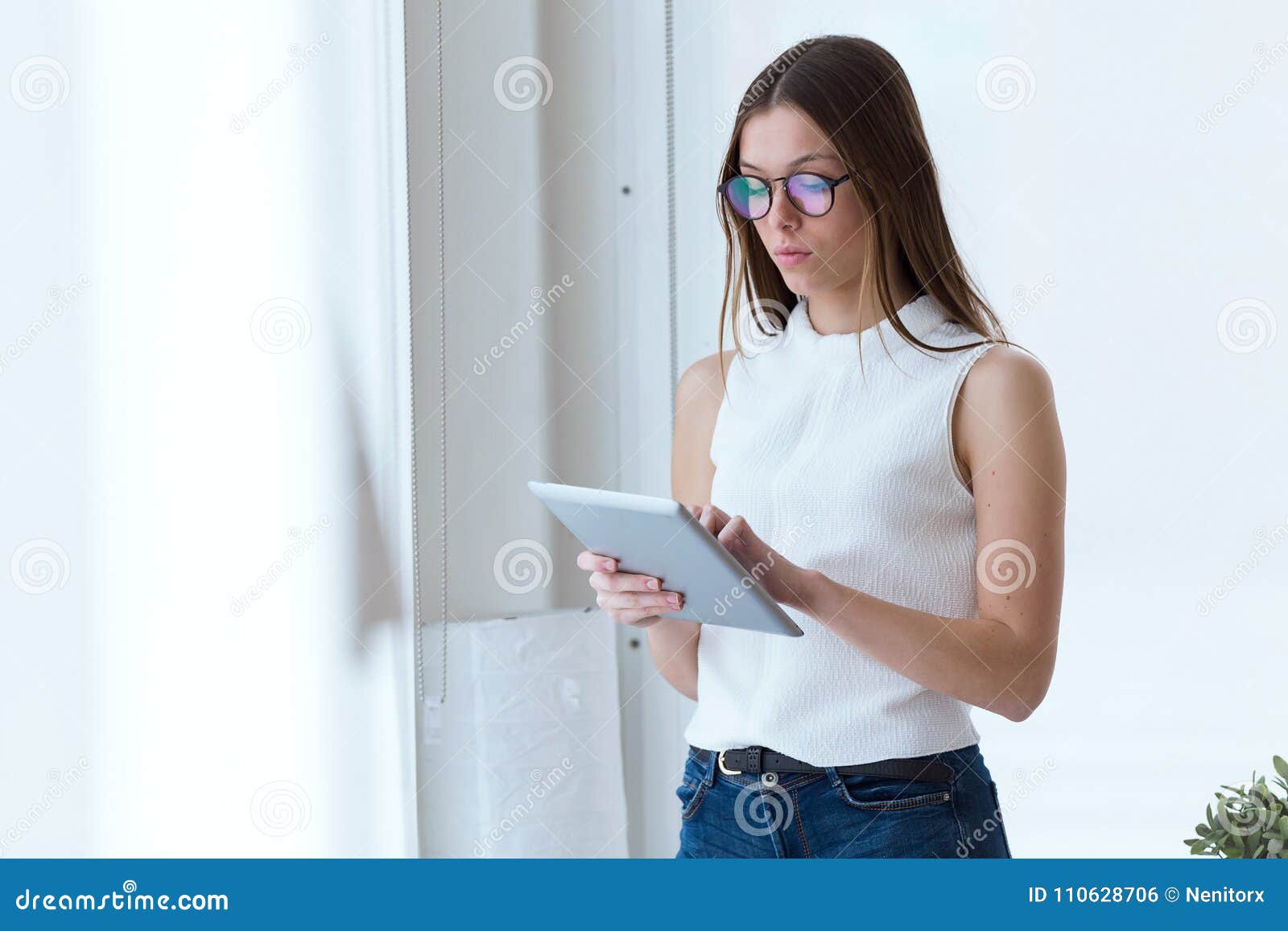 Business Young Woman Using Her Digital Tablet in the Office. Stock ... Business Young Woman Using Her Digital Tablet in the Office. Stock ...