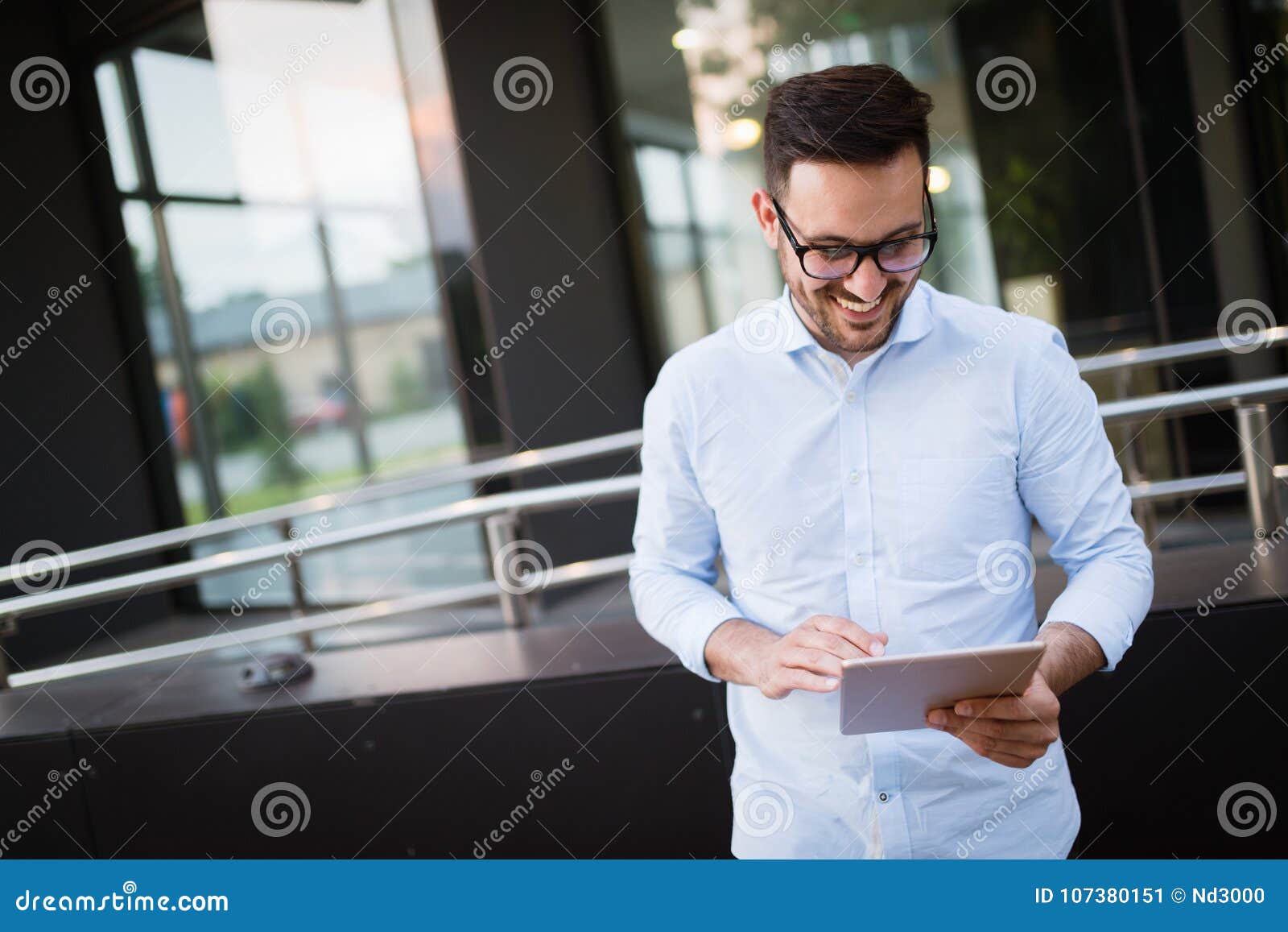 Portrait Of Businessman In Glasses Holding Tablet Stock Image Image
