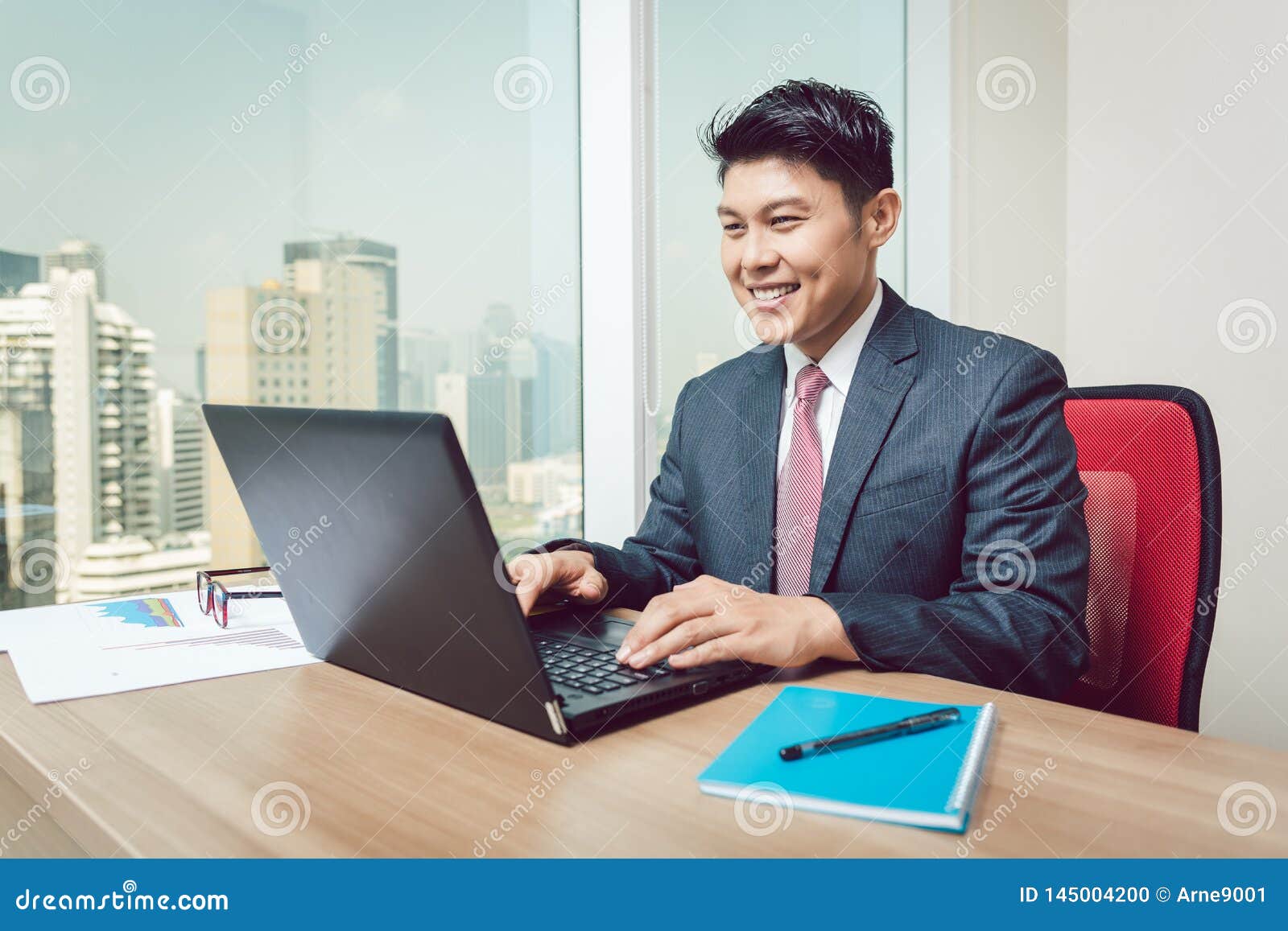Portrait of Businessman Looking at Laptop Stock Photo - Image of modern ...
