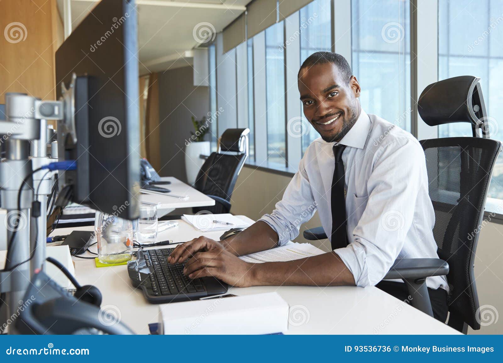 Portrait of Businessman at Office Desk Using Computer Stock Photo ...