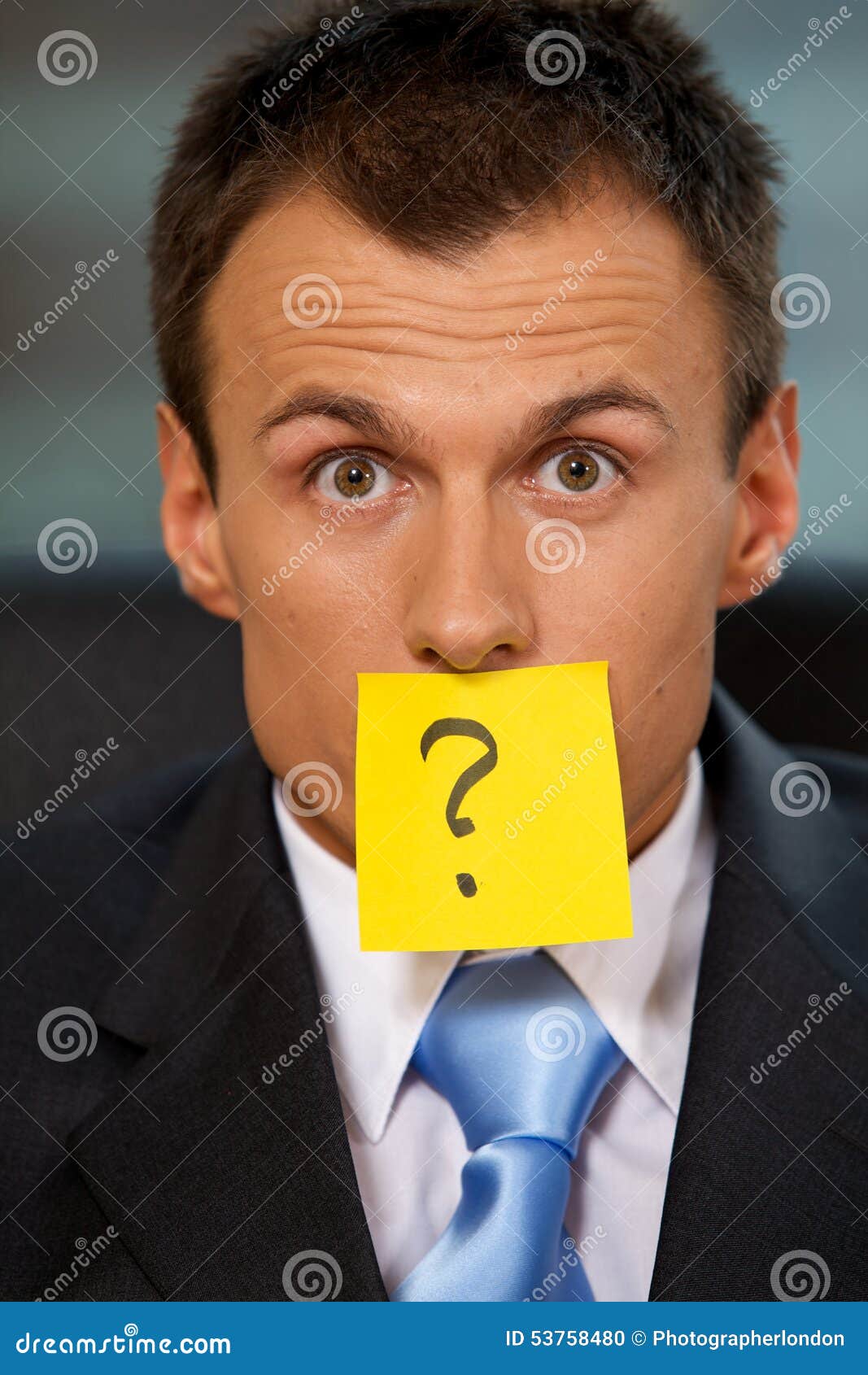 Portrait of Businessman in Office with Question Mark Written on Stock ...