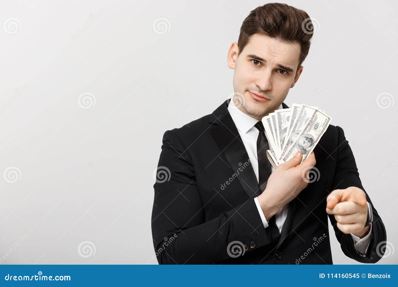 Portrait of Businessman Showing Money and Pointing Fingers Isolated ... Portrait of Businessman Showing Money and Pointing Fingers Isolated ...