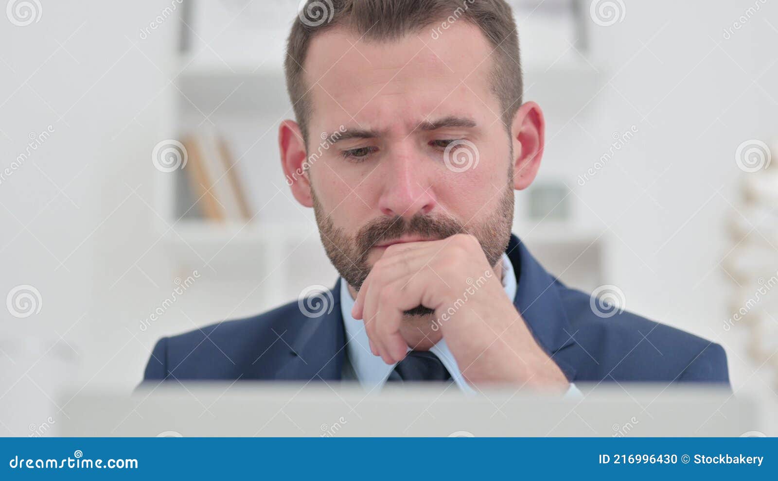 Portrait of Businessman Thinking and Working on Laptop Stock Photo ...