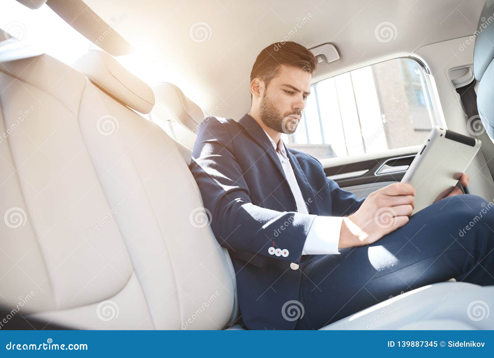 Portrait of Businessman Using Digital Tablet while Travelling Stock ... Portrait of Businessman Using Digital Tablet while Travelling Stock ...