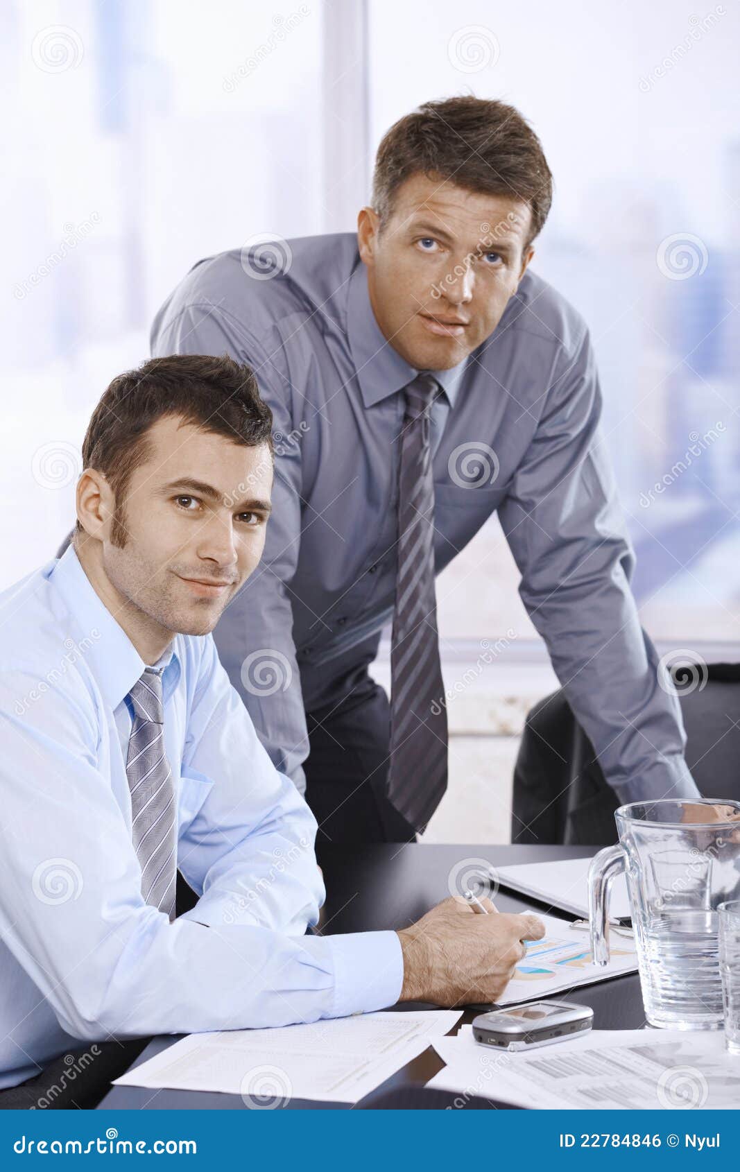 Portrait of Businessmen at Desk Stock Photo - Image of boardroom ...